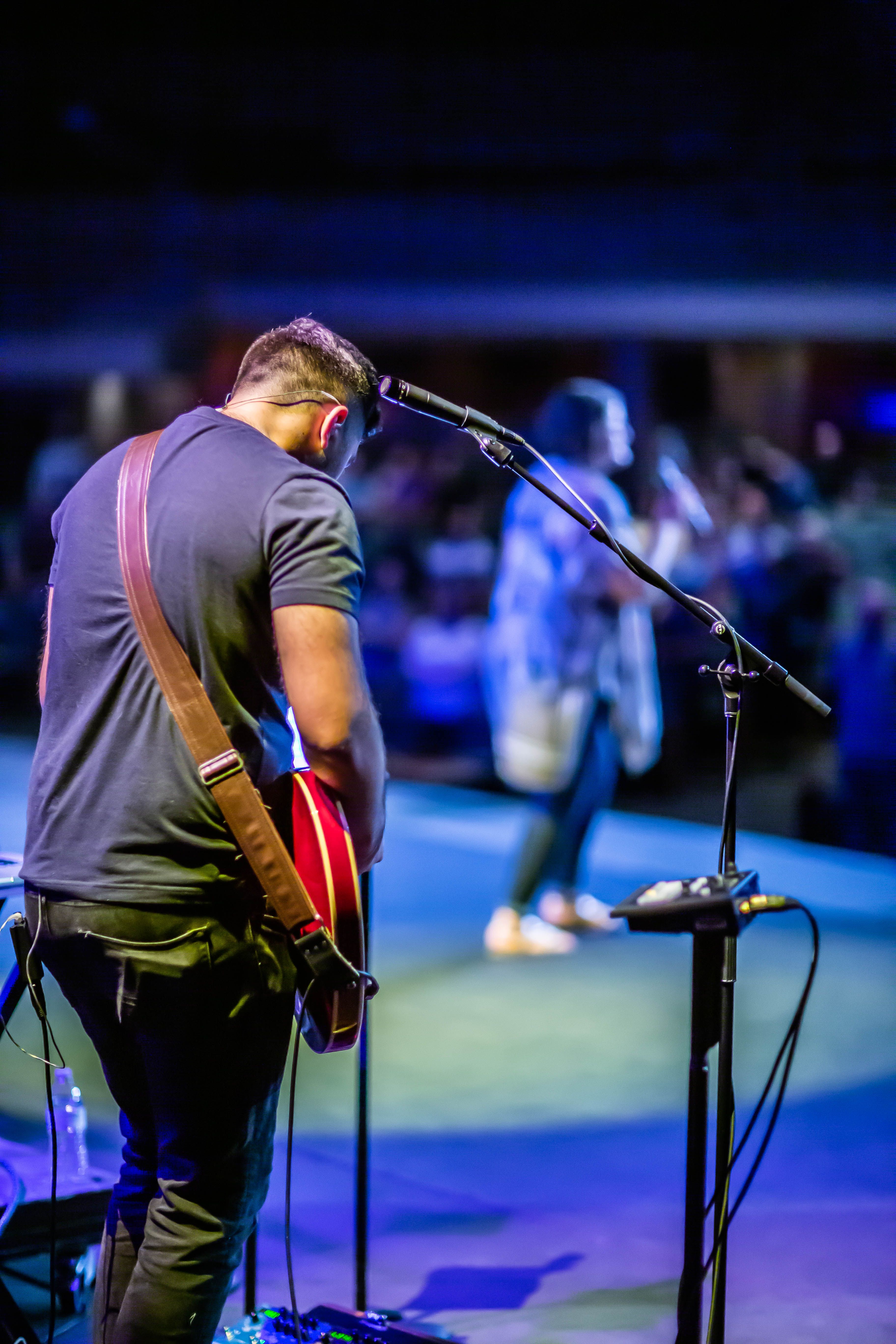 Live Music Performance with Guitarist on Stage · Free Stock Photo