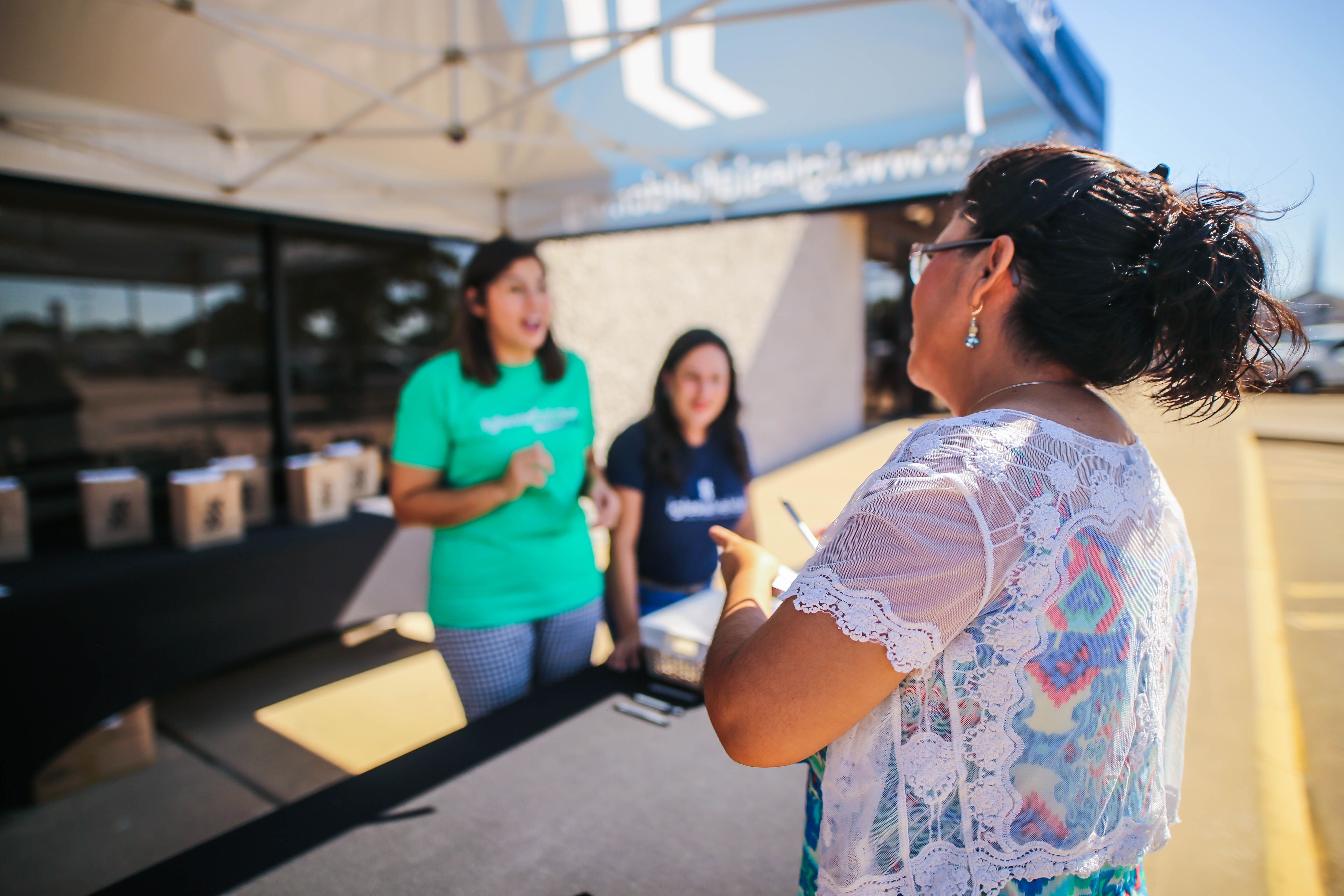 Community Event Registration Booth Outdoors · Free Stock Photo