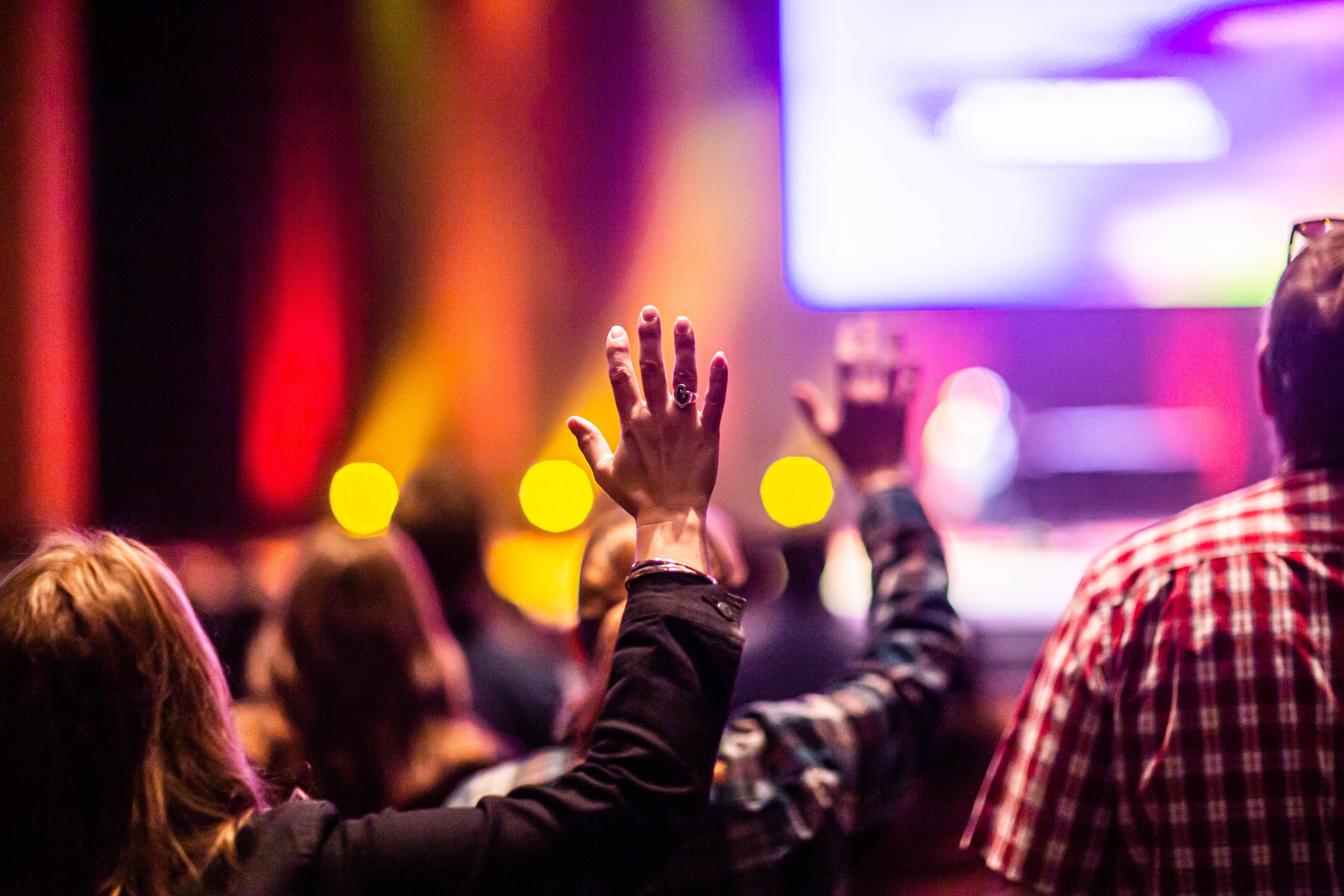 Audience Raising Hands at Vibrant Concert · Free Stock Photo