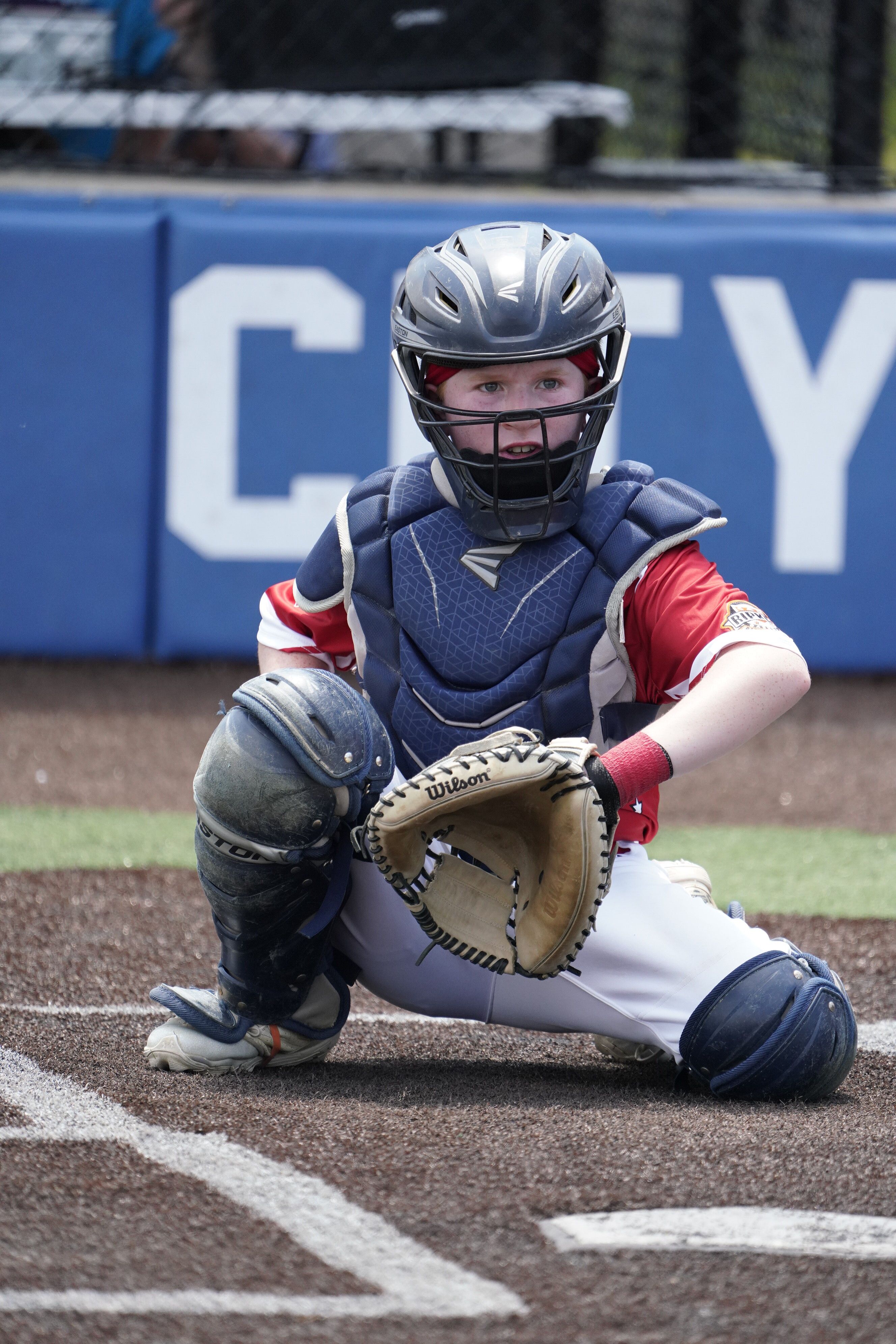 Young Catcher in Action on Baseball Field · Free Stock Photo