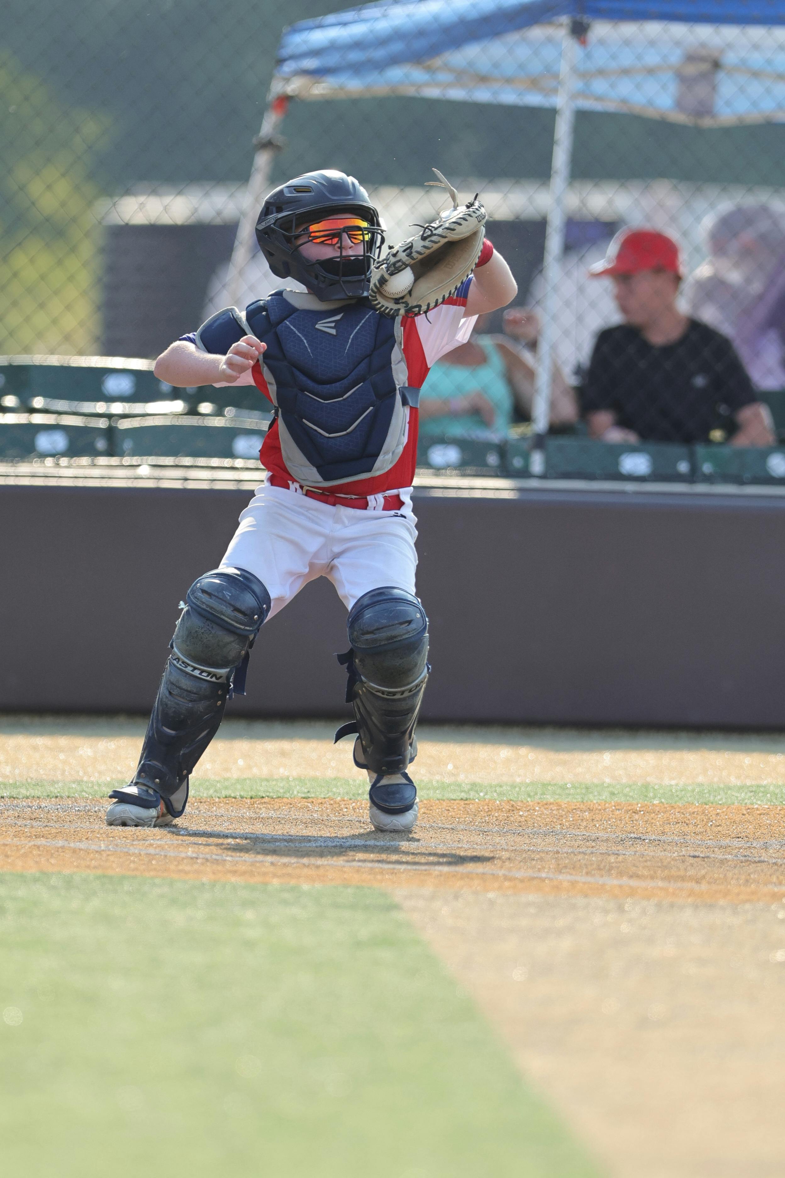Youth Baseball Catcher in Action During Day Game · Free Stock Photo