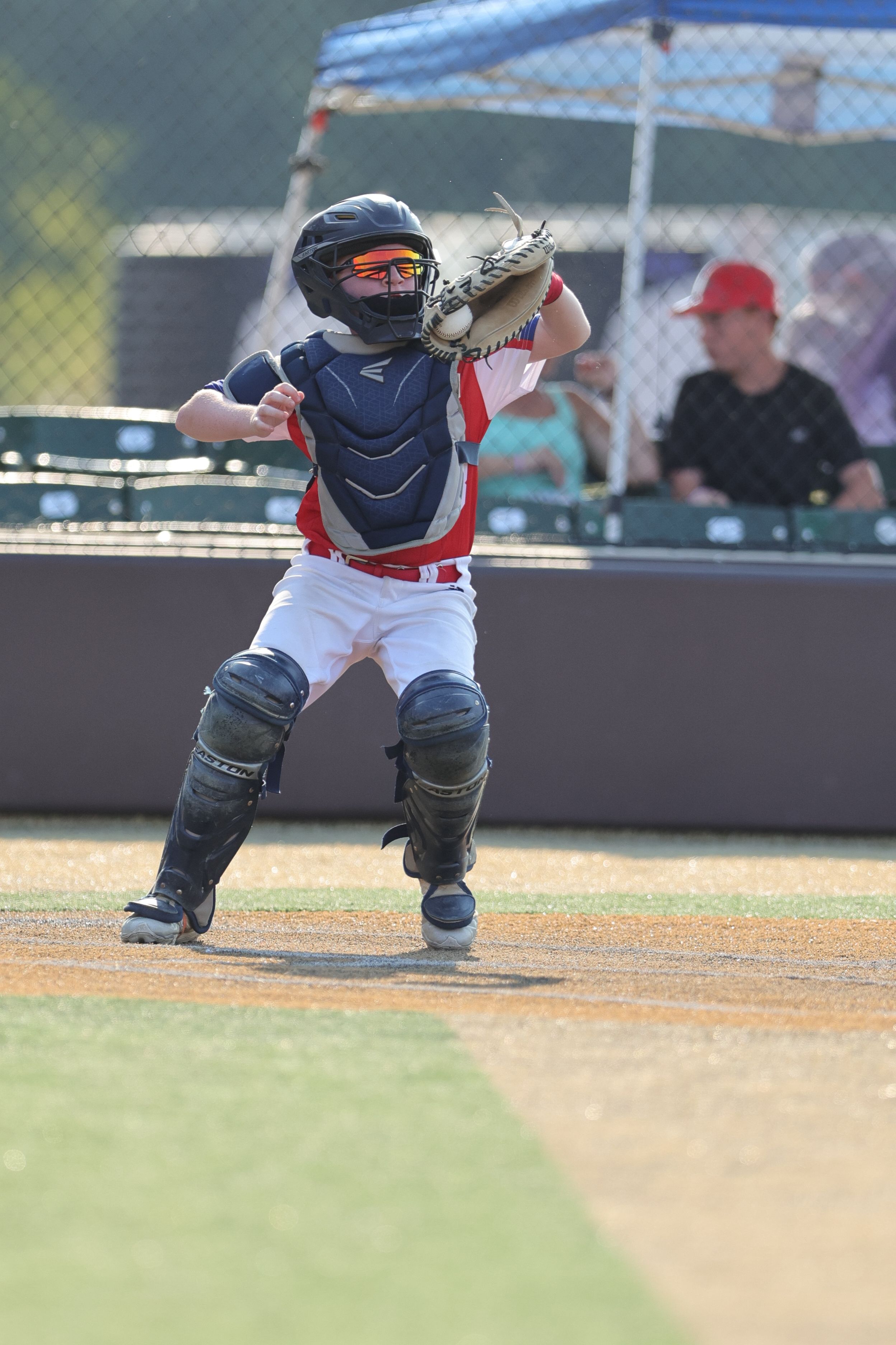 Youth Baseball Catcher in Action During Day Game · Free Stock Photo
