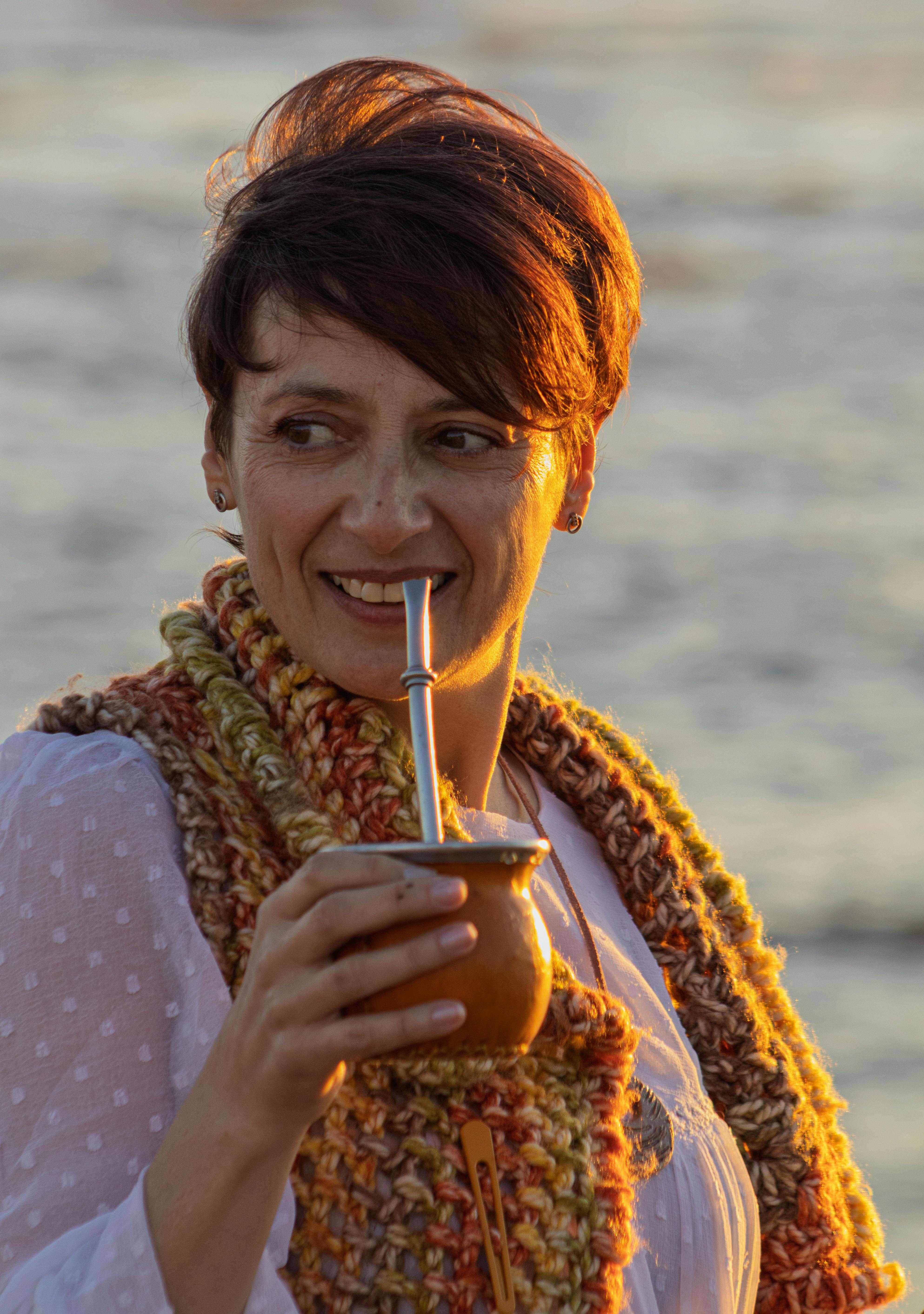 Woman Enjoying Yerba Mate on Montevideo Beach · Free Stock Photo