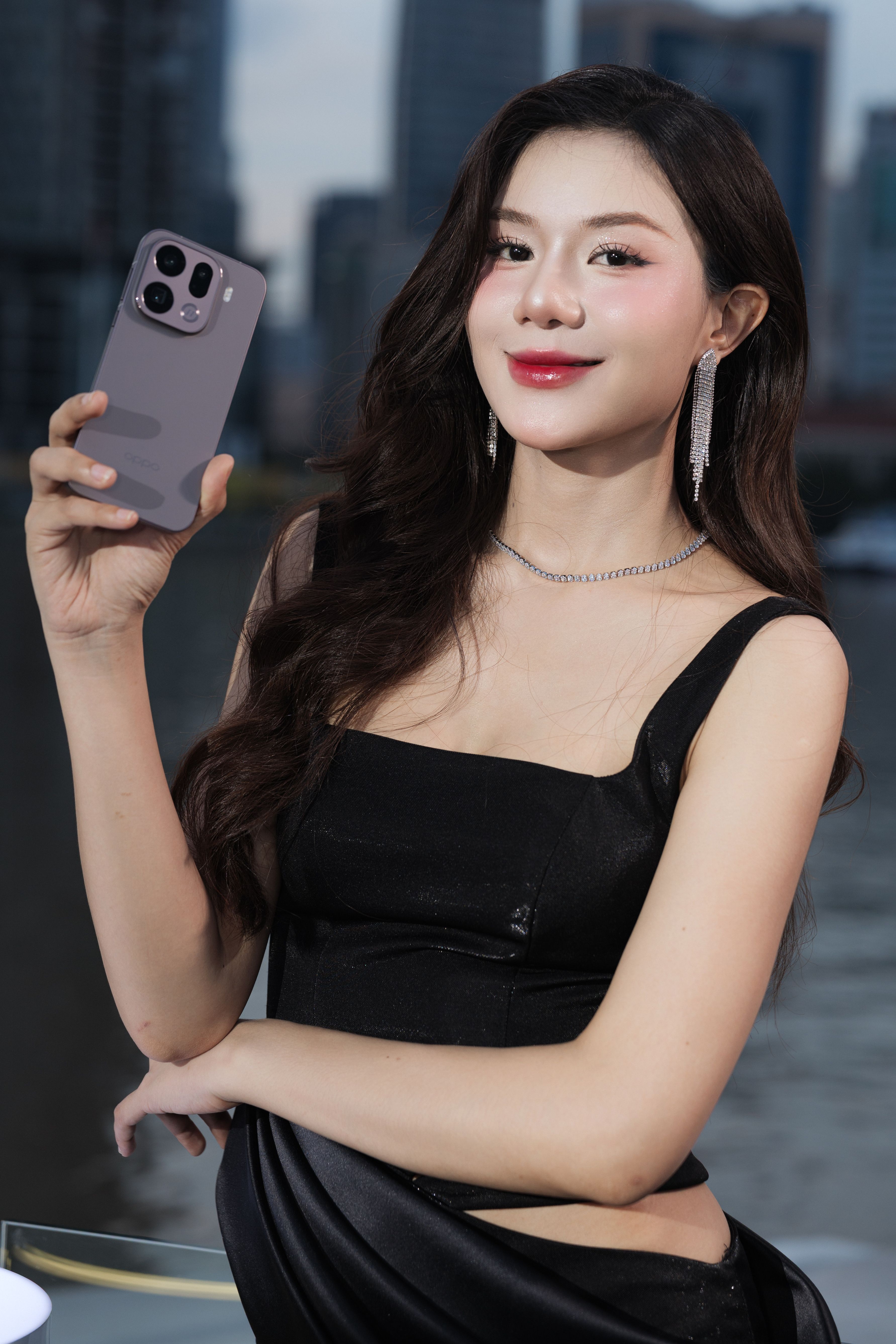 Stylish Woman Posing with Smartphone Outdoors · Free Stock Photo