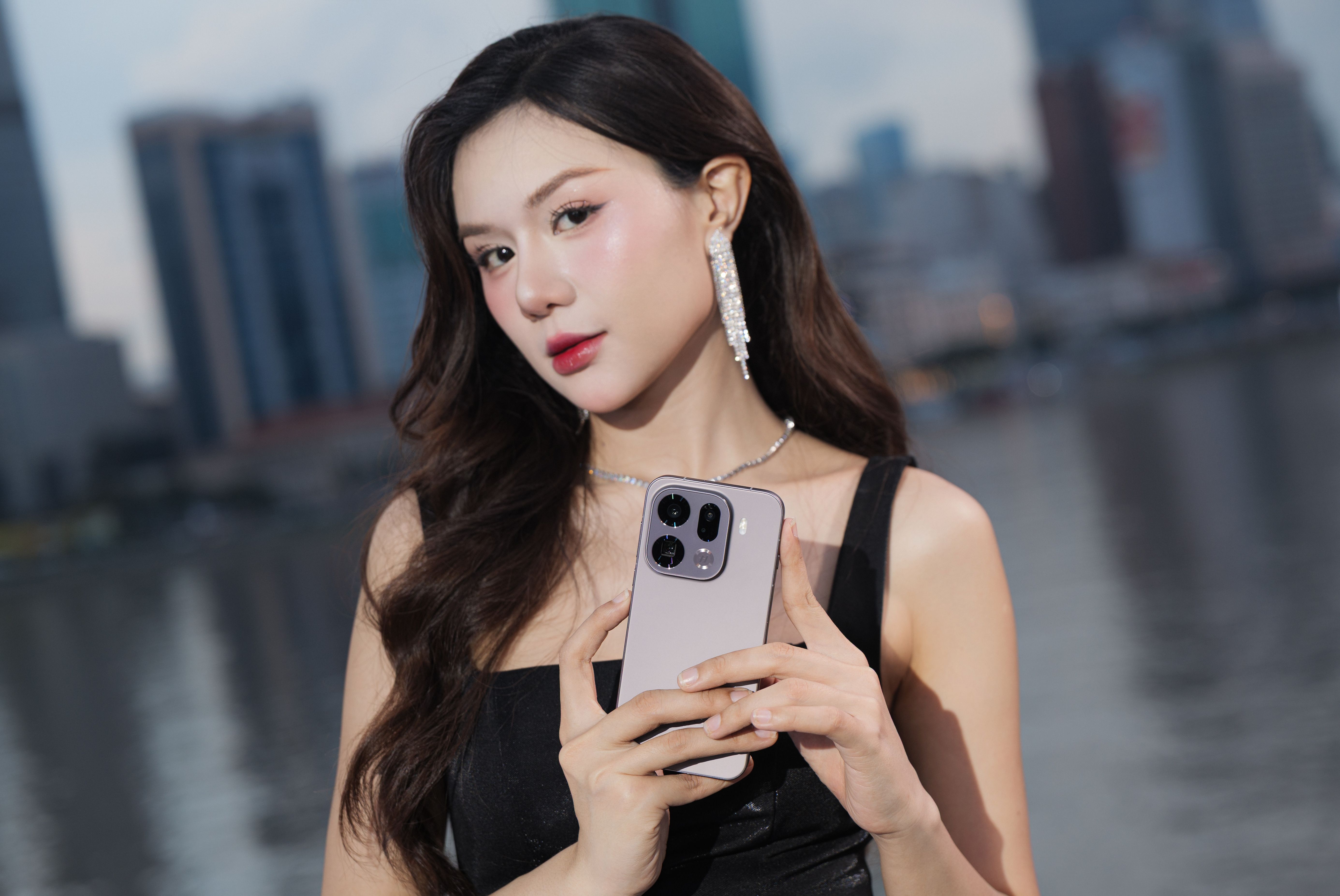 Stylish Woman Posing with Smartphone Outdoors · Free Stock Photo