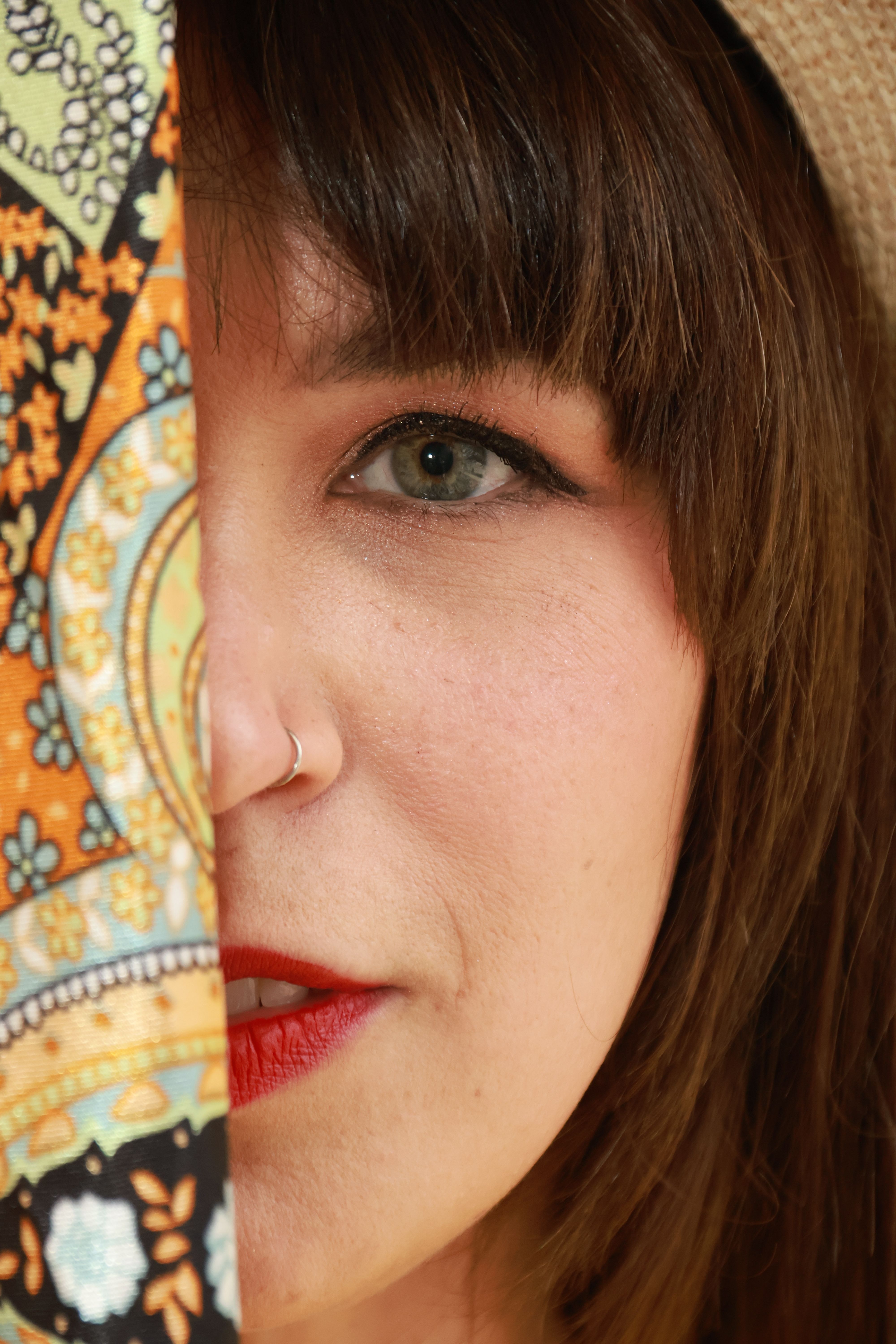 Close-Up Portrait of Woman with Colorful Fabric · Free Stock Photo
