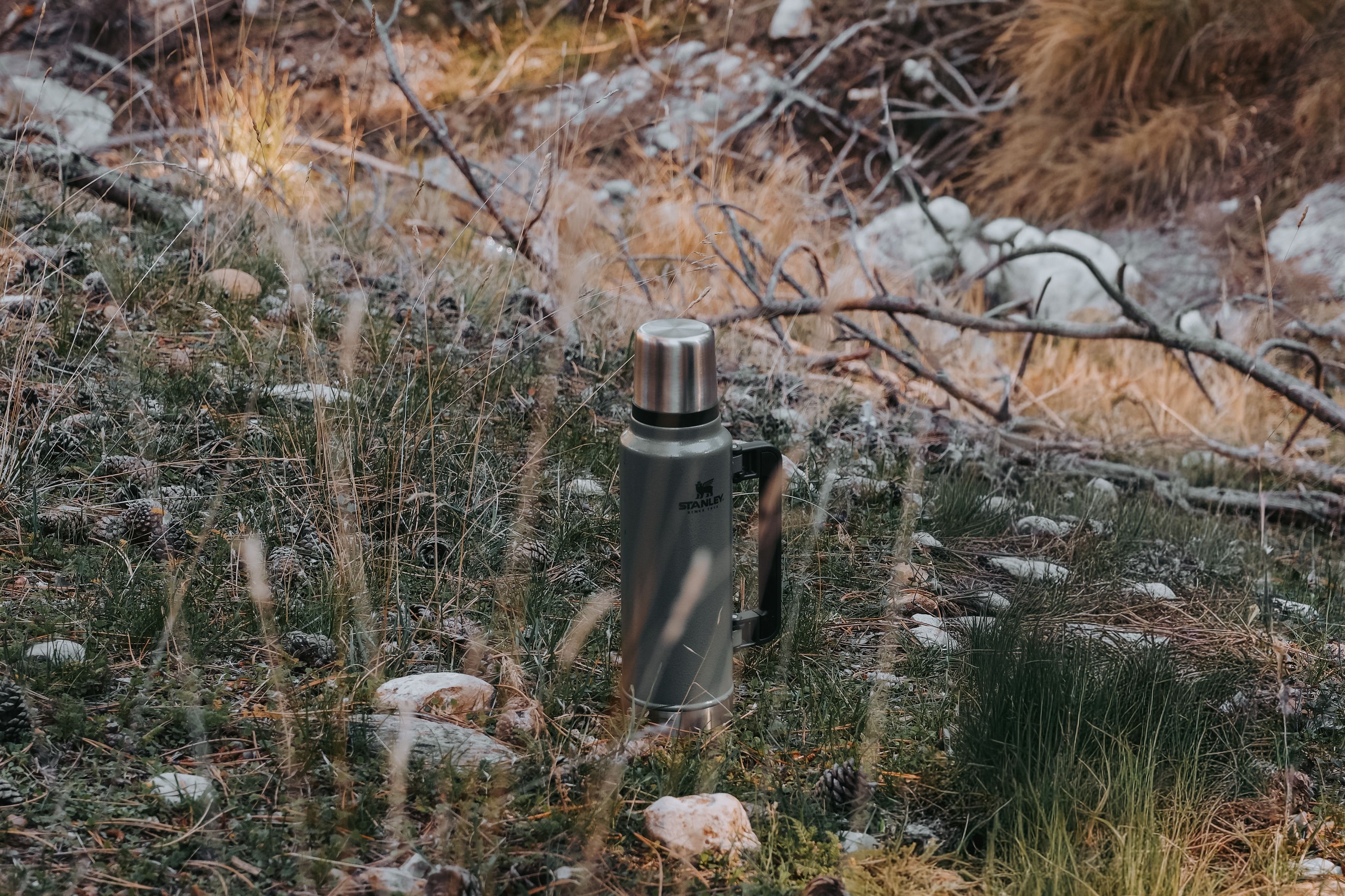 Outdoor Adventure Thermos in Natural Setting · Free Stock Photo