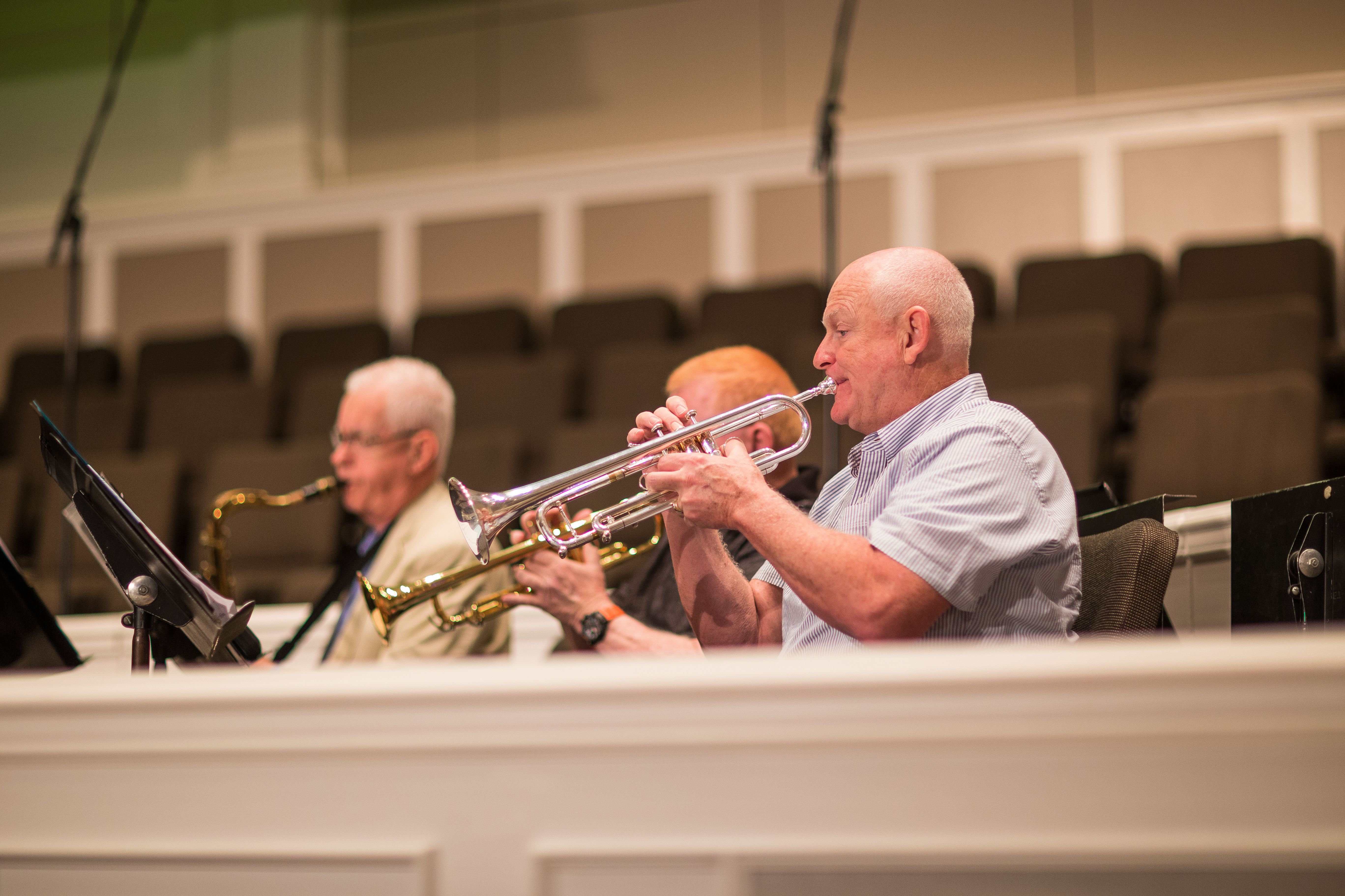 Senior Musicians Playing Brass Instruments in Concert · Free Stock Photo