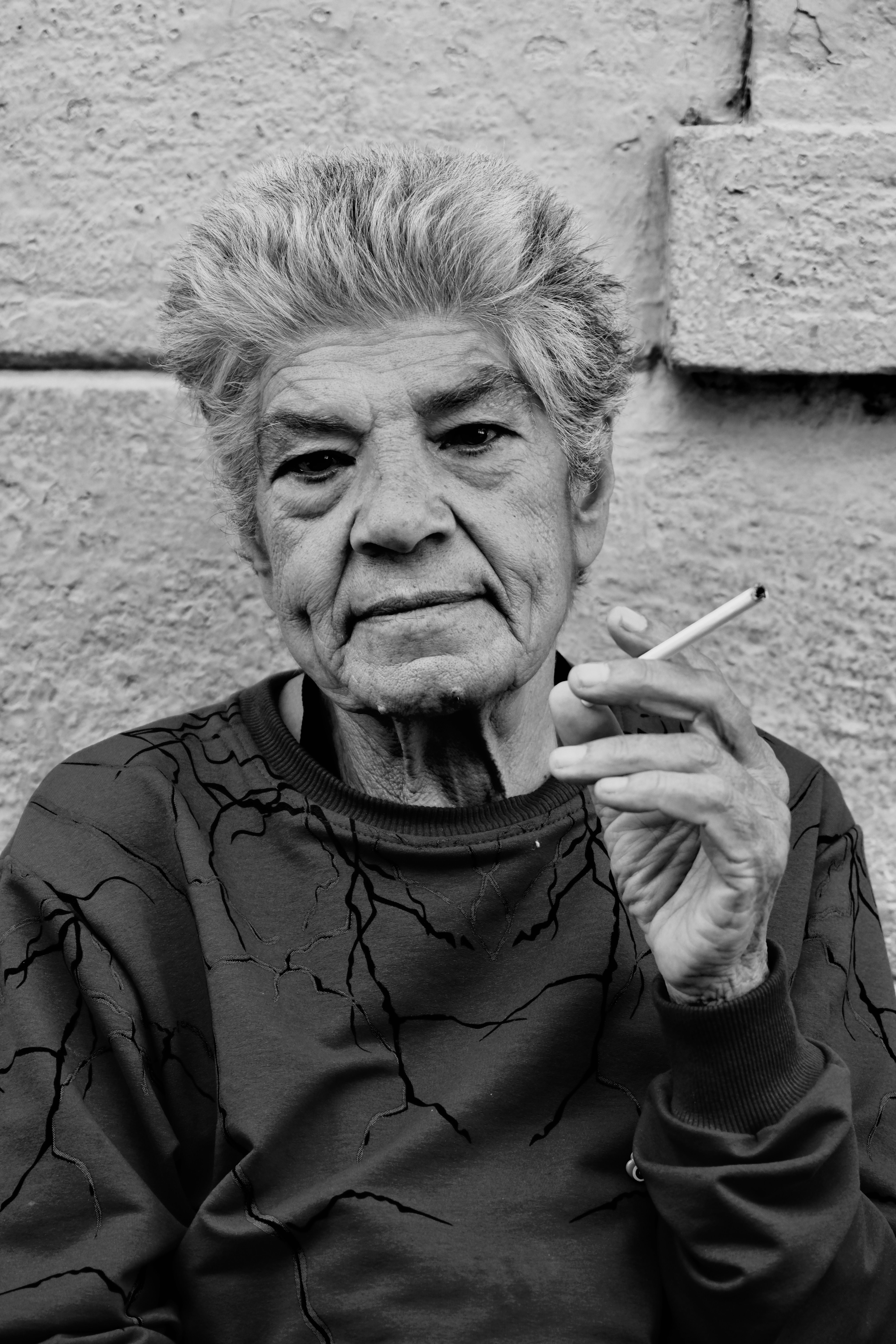 Elderly Woman with Cigarette in Black and White · Free Stock Photo