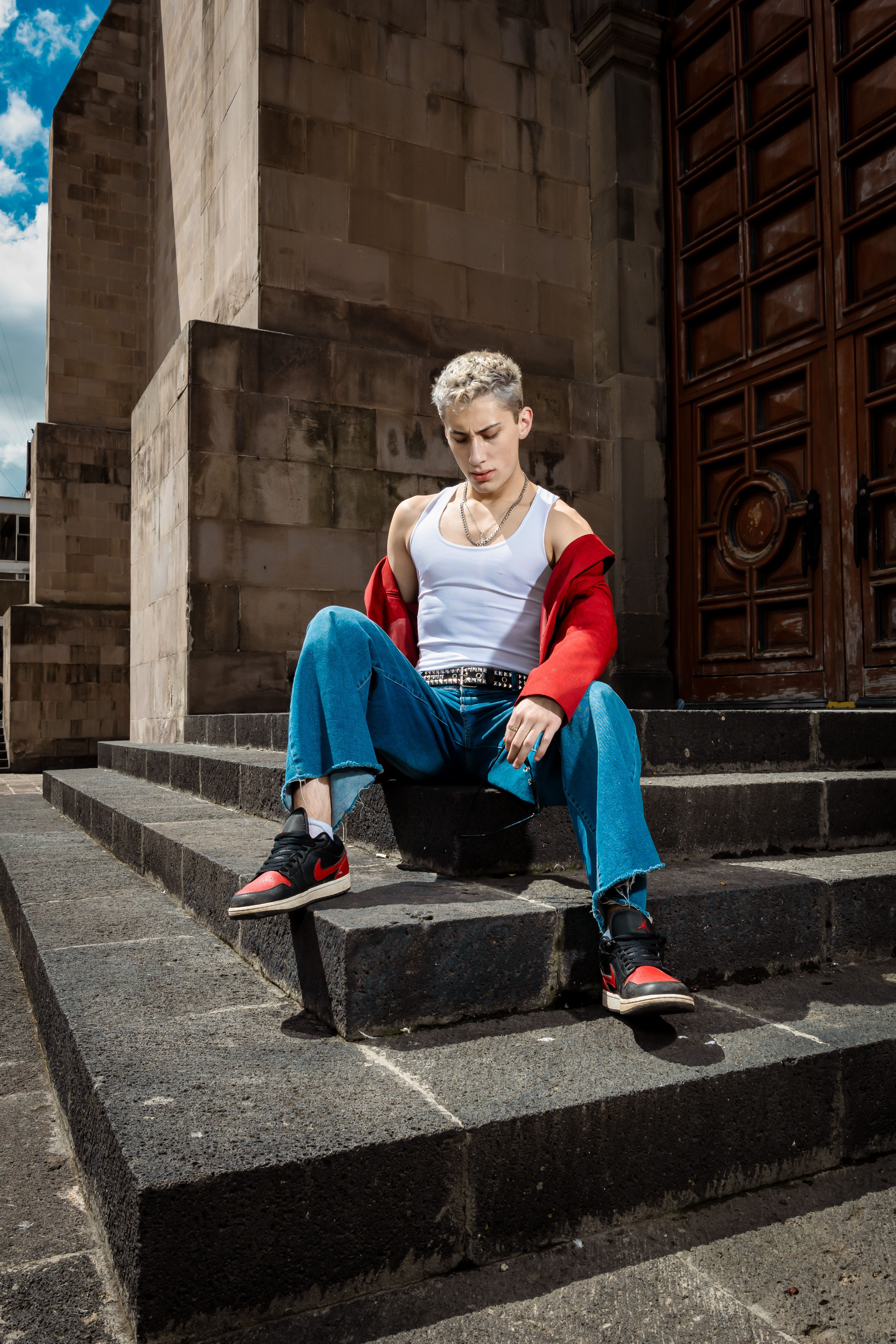 Fashionable Young Man Sitting on Urban Steps · Free Stock Photo