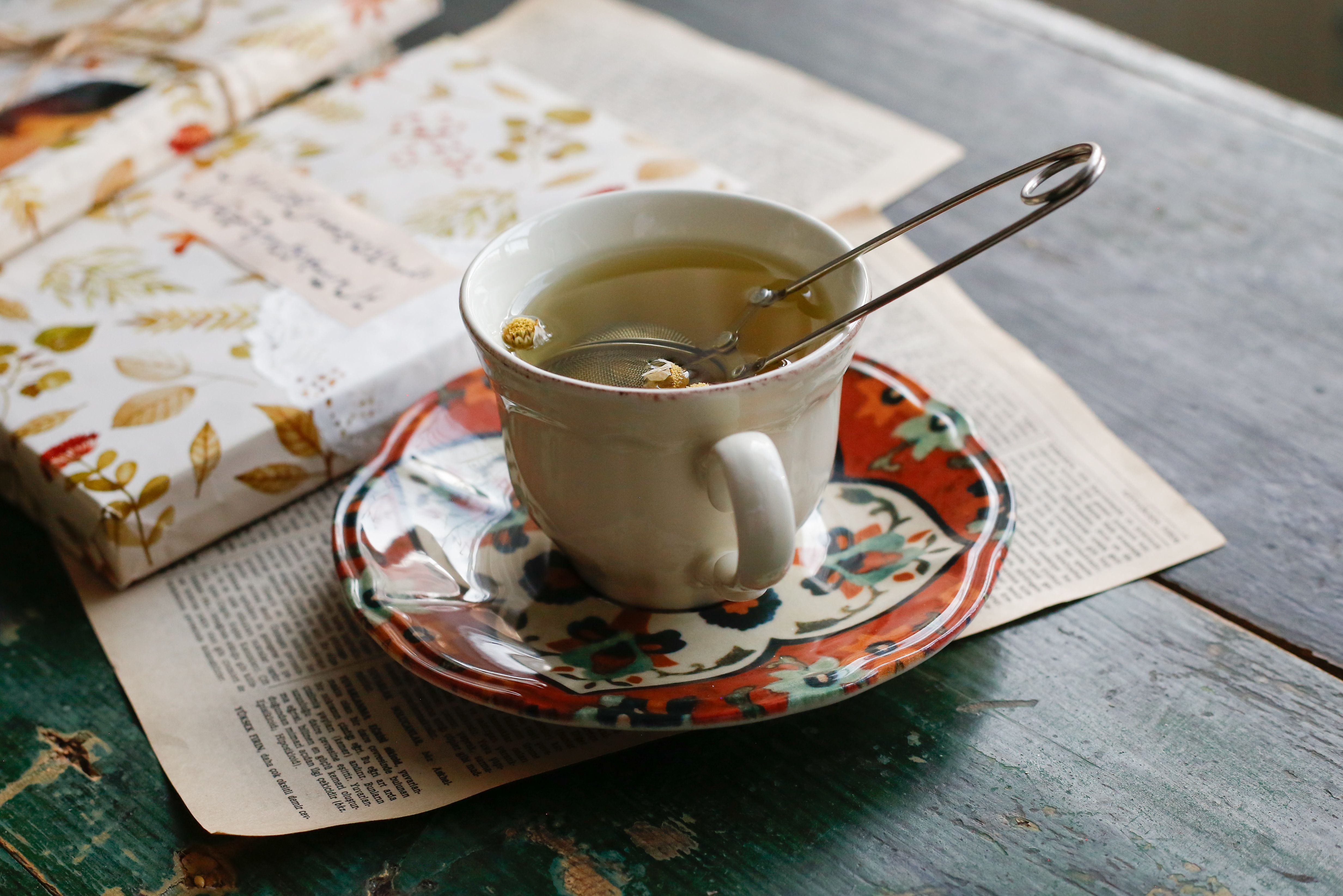 Cozy Tea Time with Chamomile on Rustic Table · Free Stock Photo