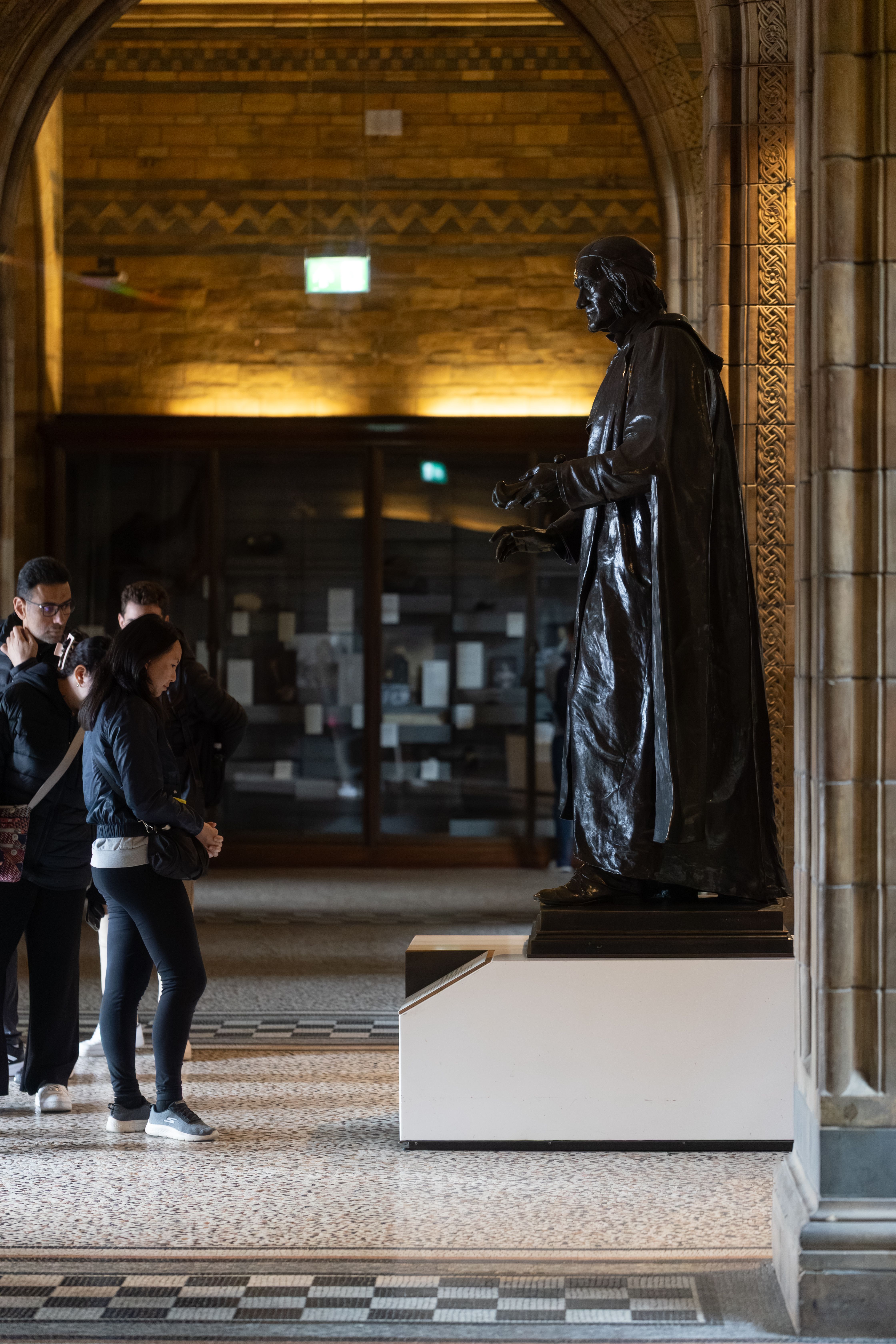 Visitors Observing Statue in Historic Museum Hall · Free Stock Photo