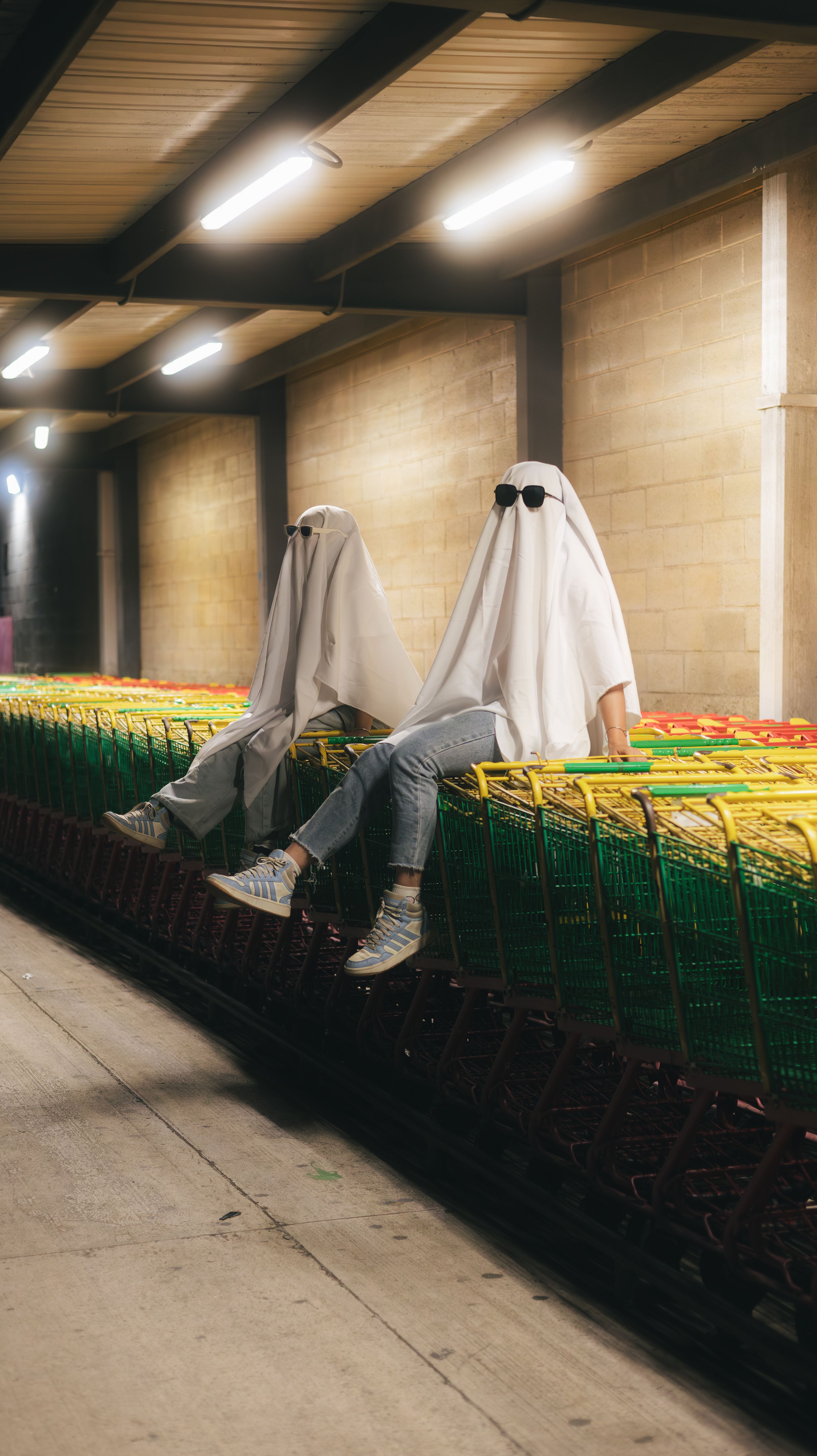 Spooky Ghosts in a Shopping Cart Warehouse · Free Stock Photo