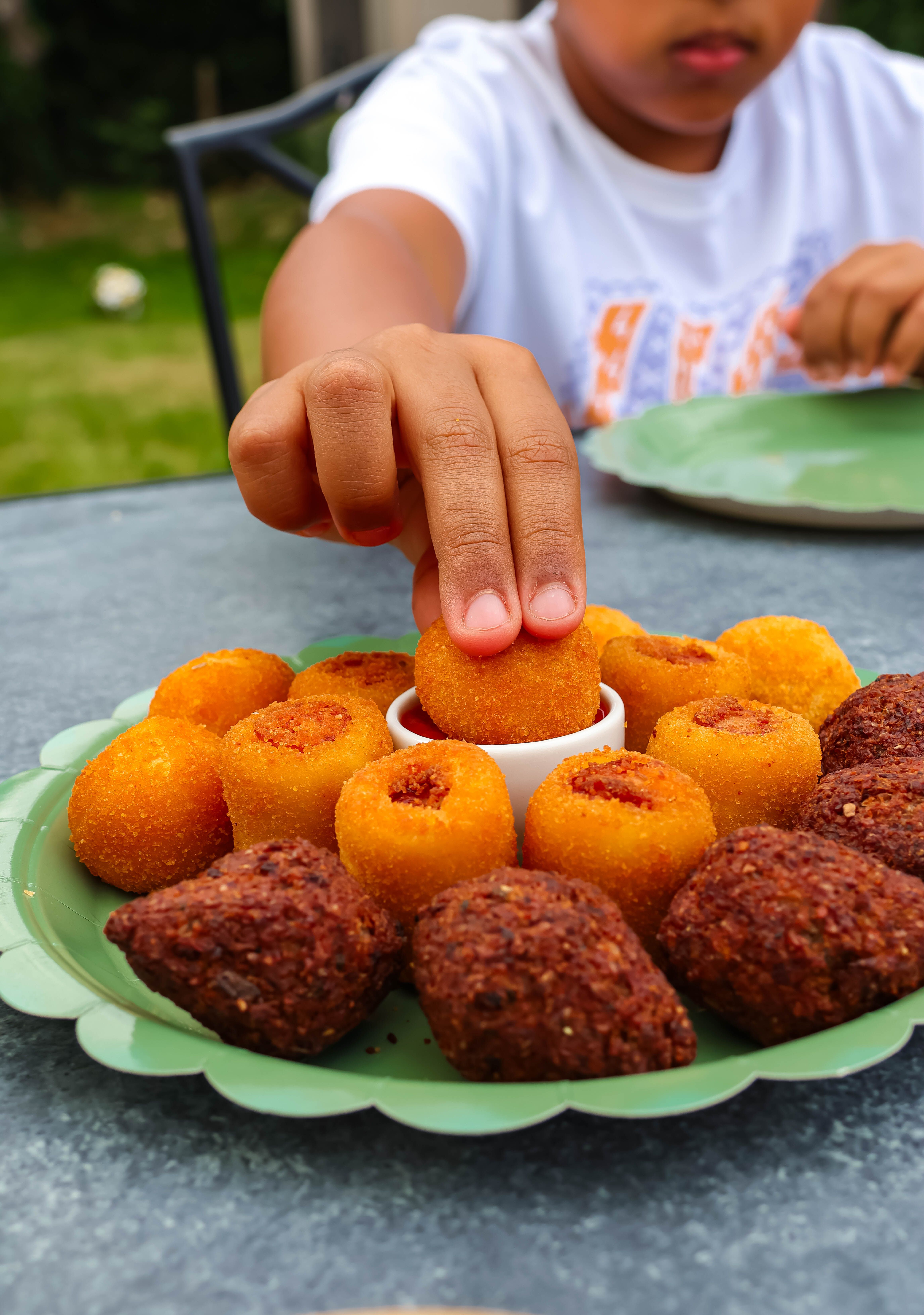 Child Enjoying Savory Snacks Outdoors in London · Free Stock Photo