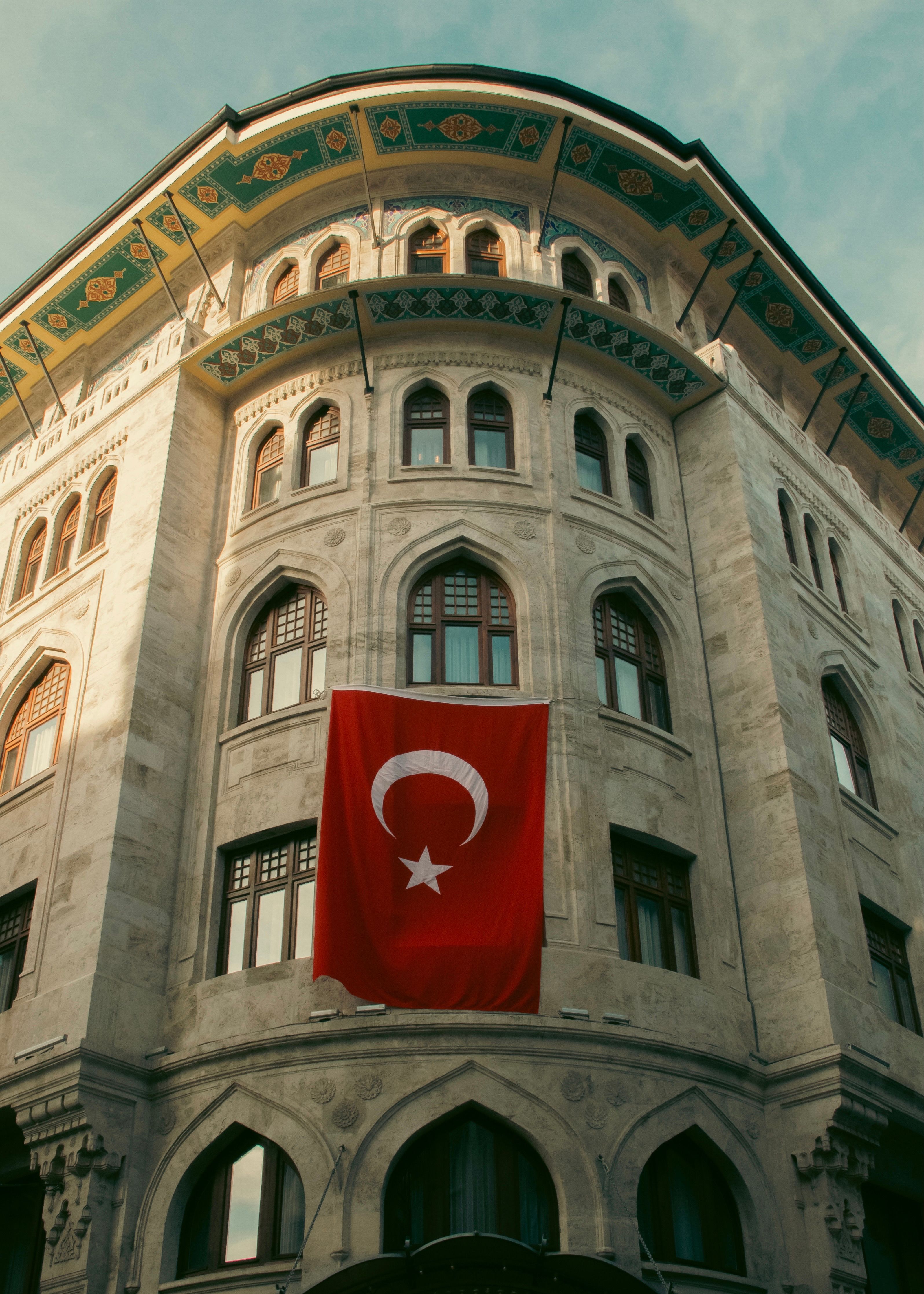 Historic Sirkeci Building with Turkish Flag · Free Stock Photo