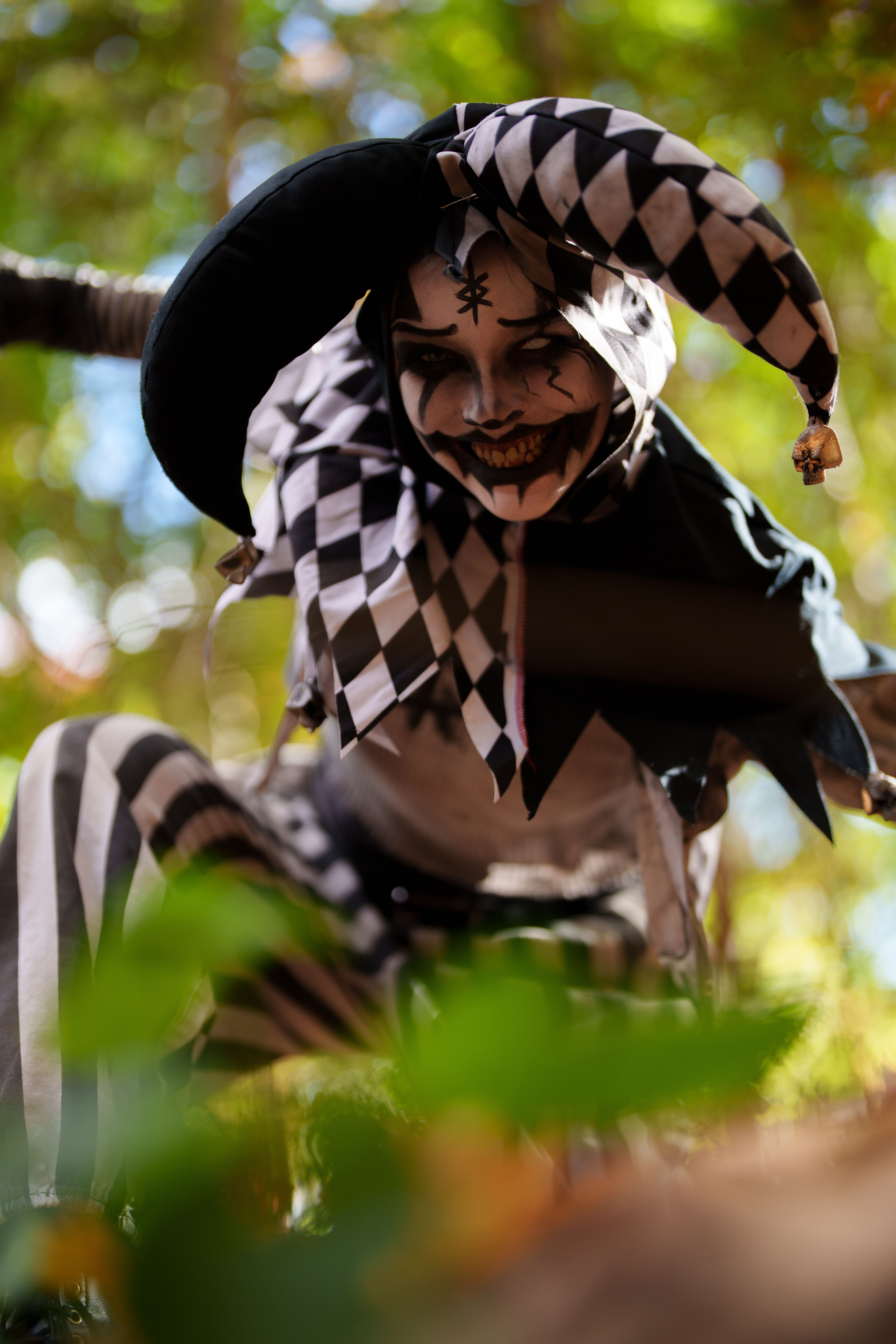 Creepy Jester in Black and White Costume Outdoors · Free Stock Photo