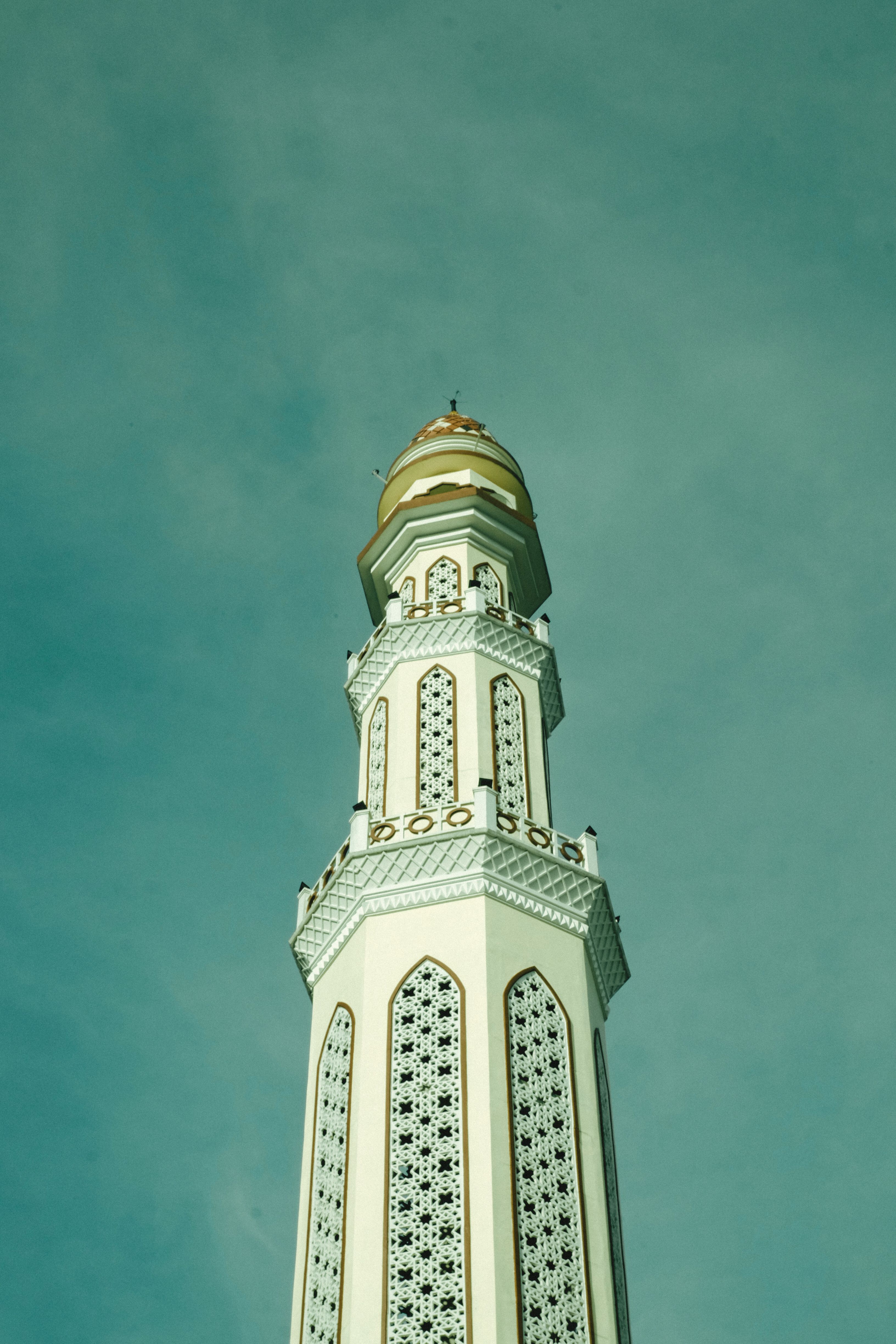 Majestic Islamic Minaret Against Blue Sky · Free Stock Photo
