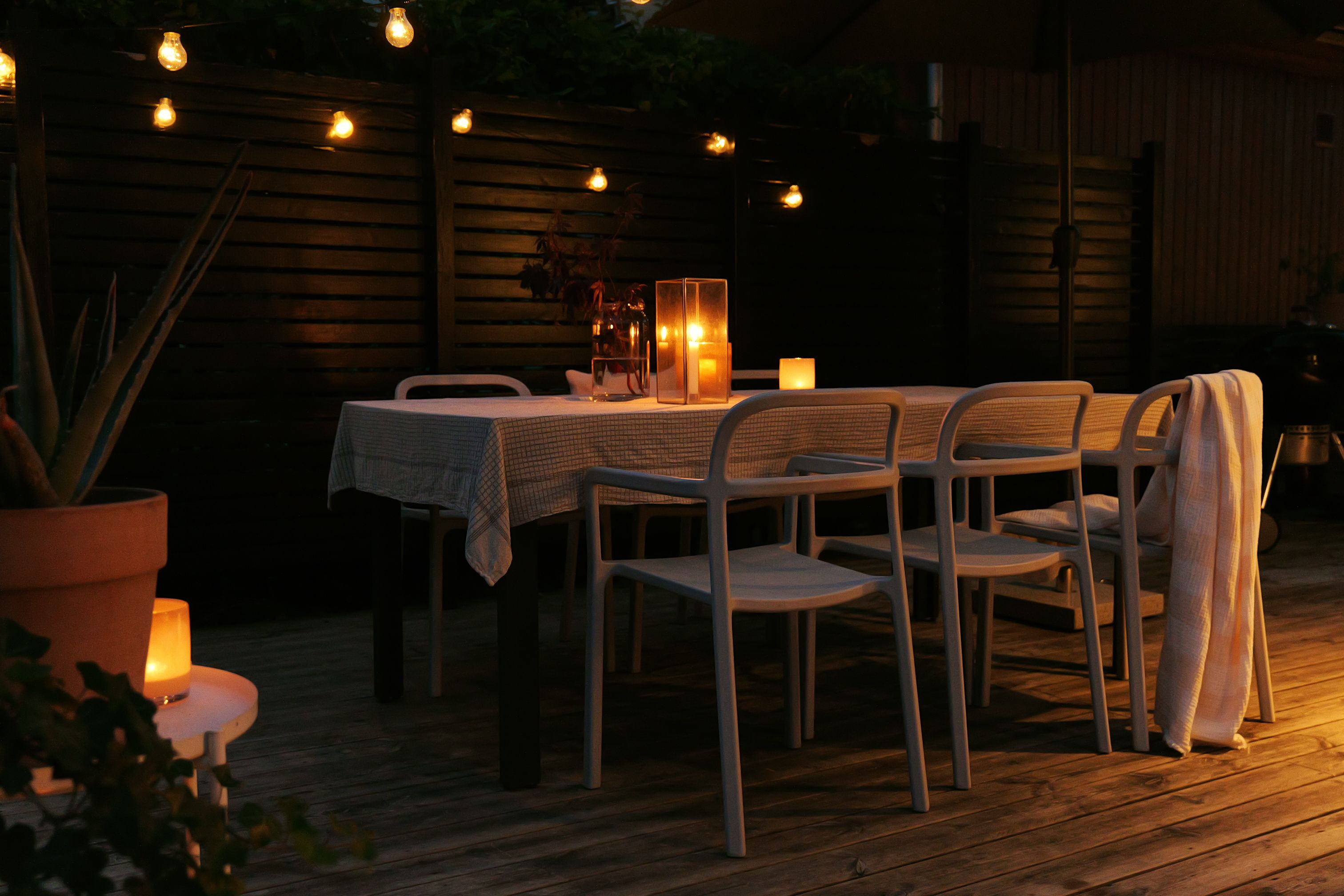 Cozy Evening Terrace Setup with Candlelight · Free Stock Photo