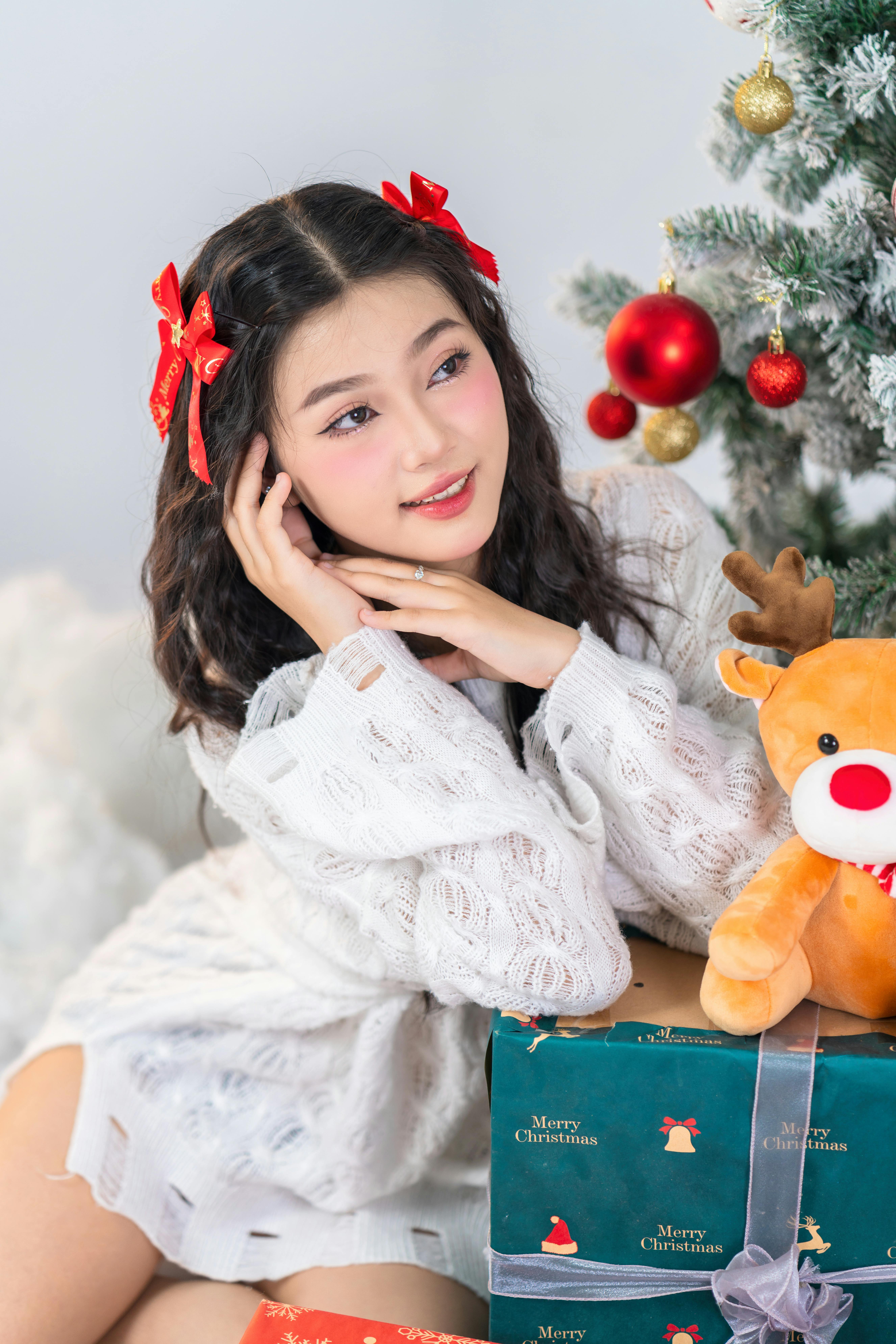 Festive Portrait of Woman by Christmas Tree · Free Stock Photo