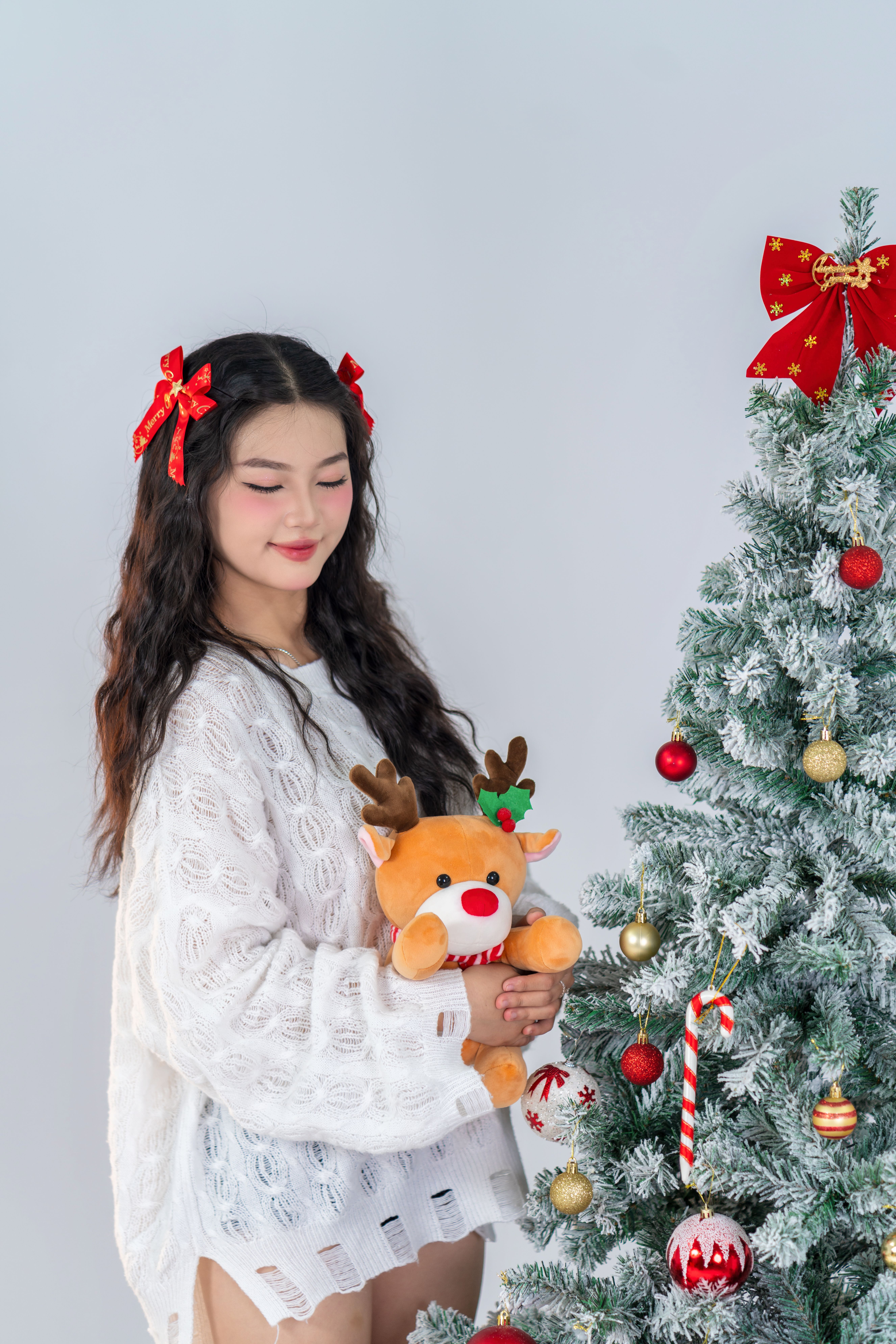 Young Woman Celebrating Christmas with Festive Tree · Free Stock Photo