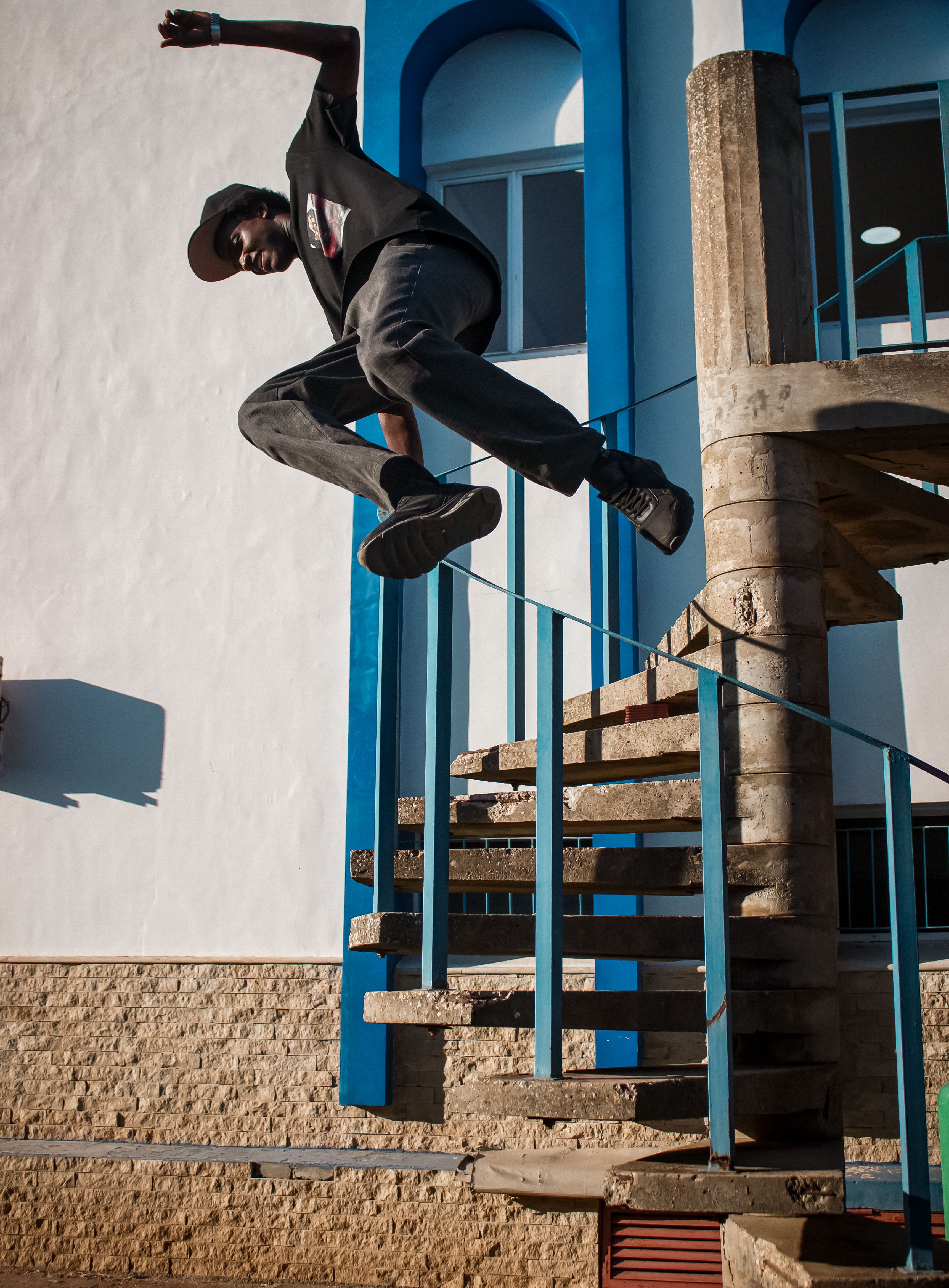 Dynamic Parkour Action on Urban Staircase · Free Stock Photo