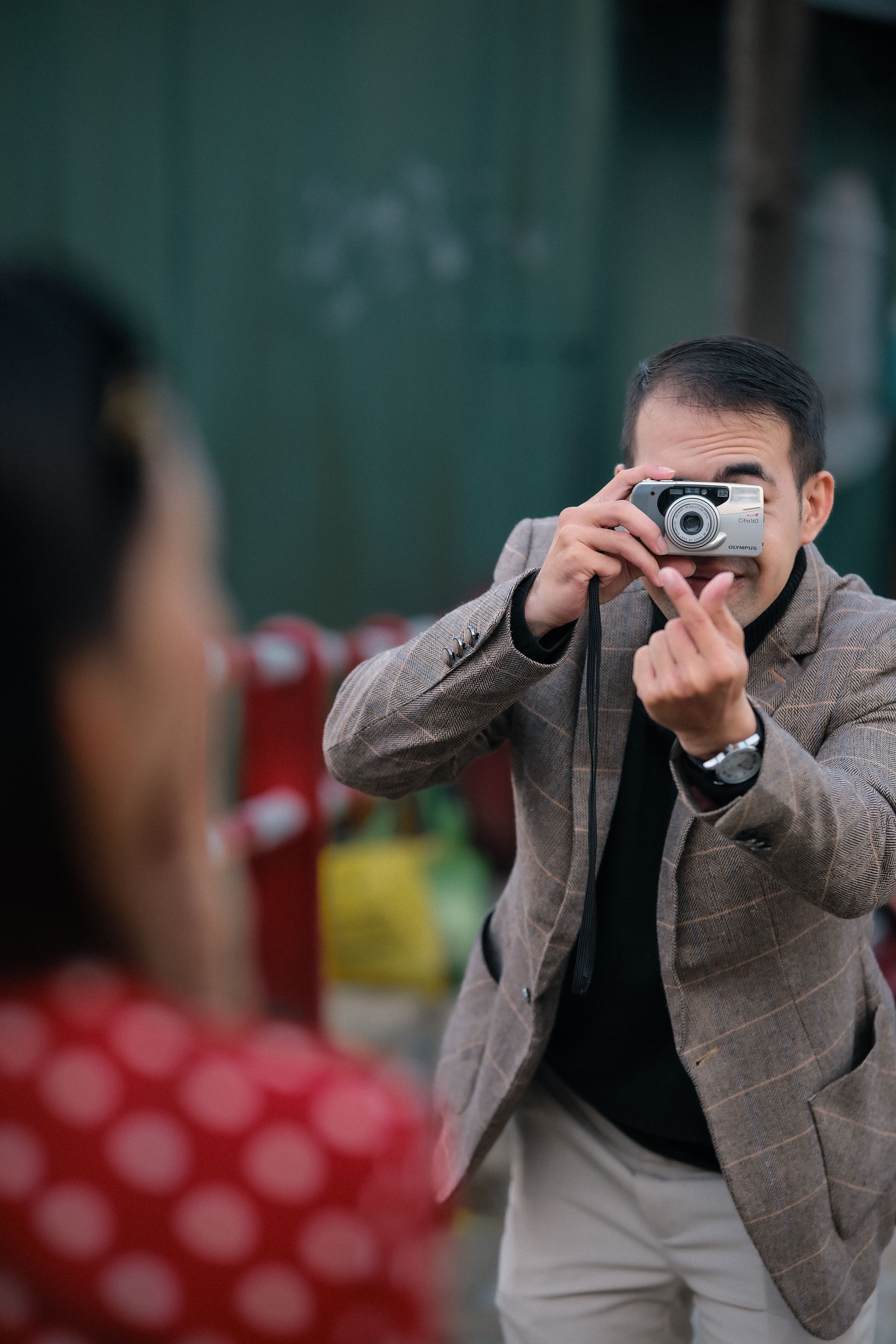 Man Taking Photograph Outdoors with Vintage Camera · Free Stock Photo
