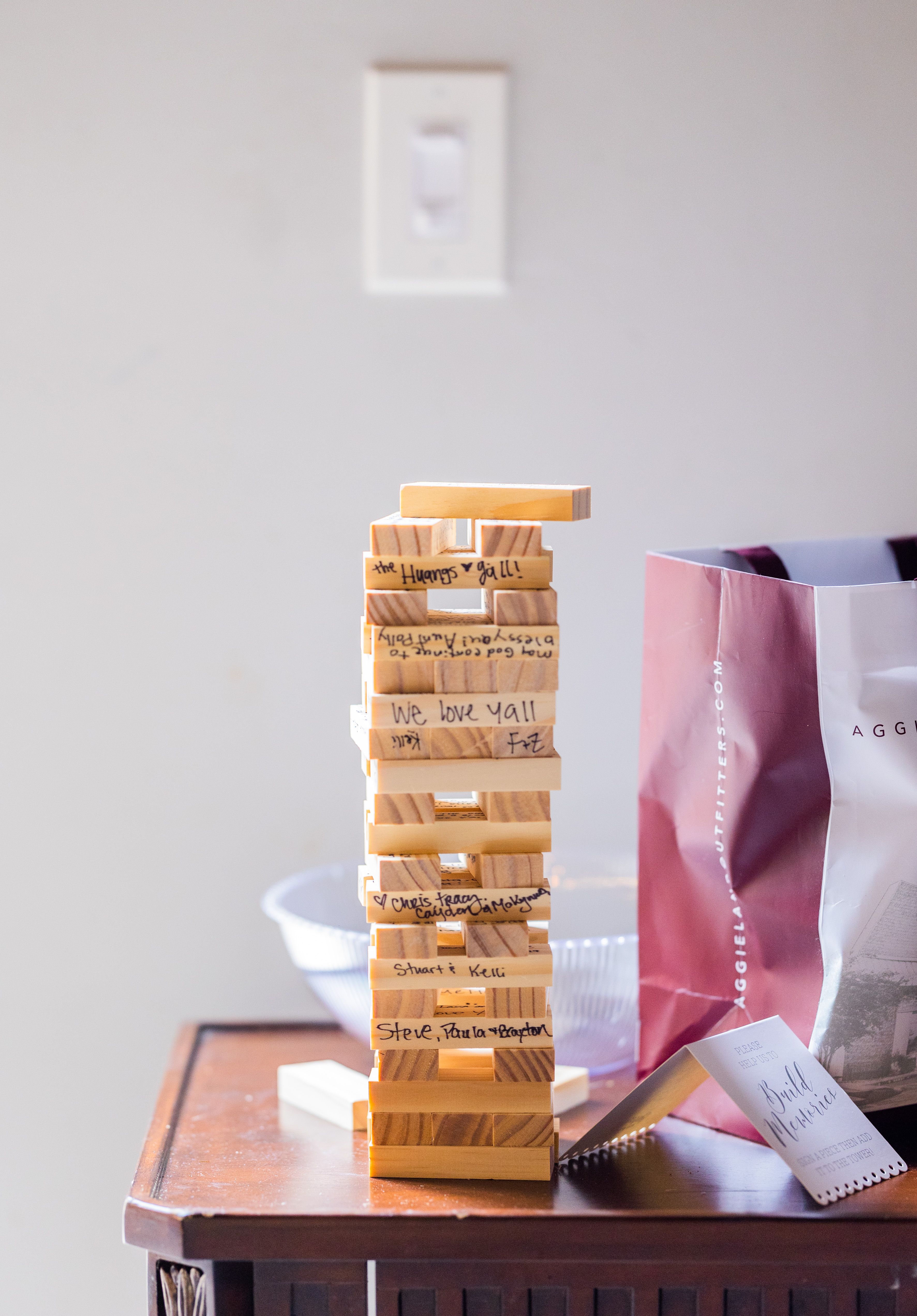 Stack of Jenga Blocks on a Wooden Table · Free Stock Photo