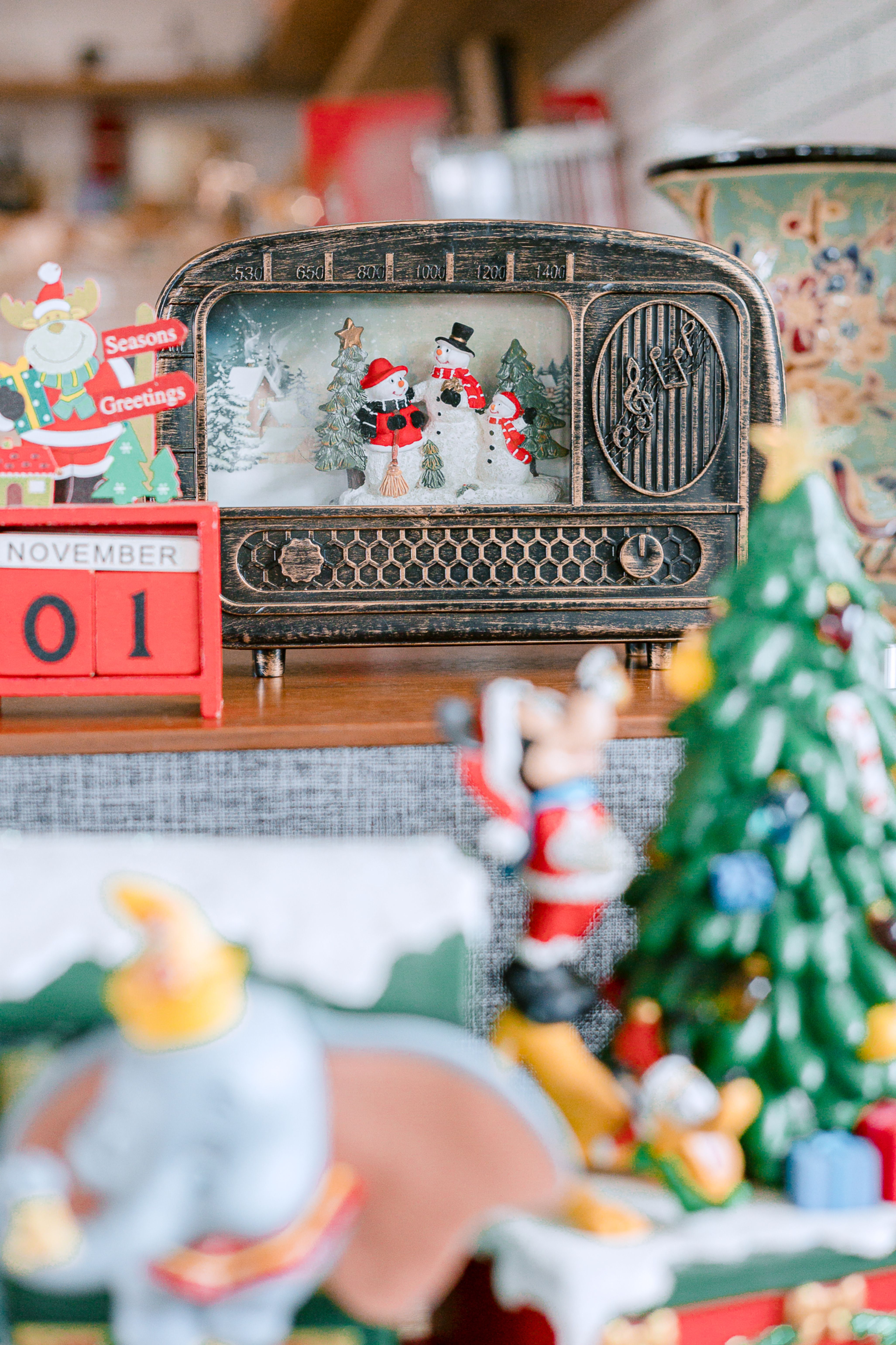 Festive Christmas Decor with Snowmen on Vintage Radio · Free Stock Photo