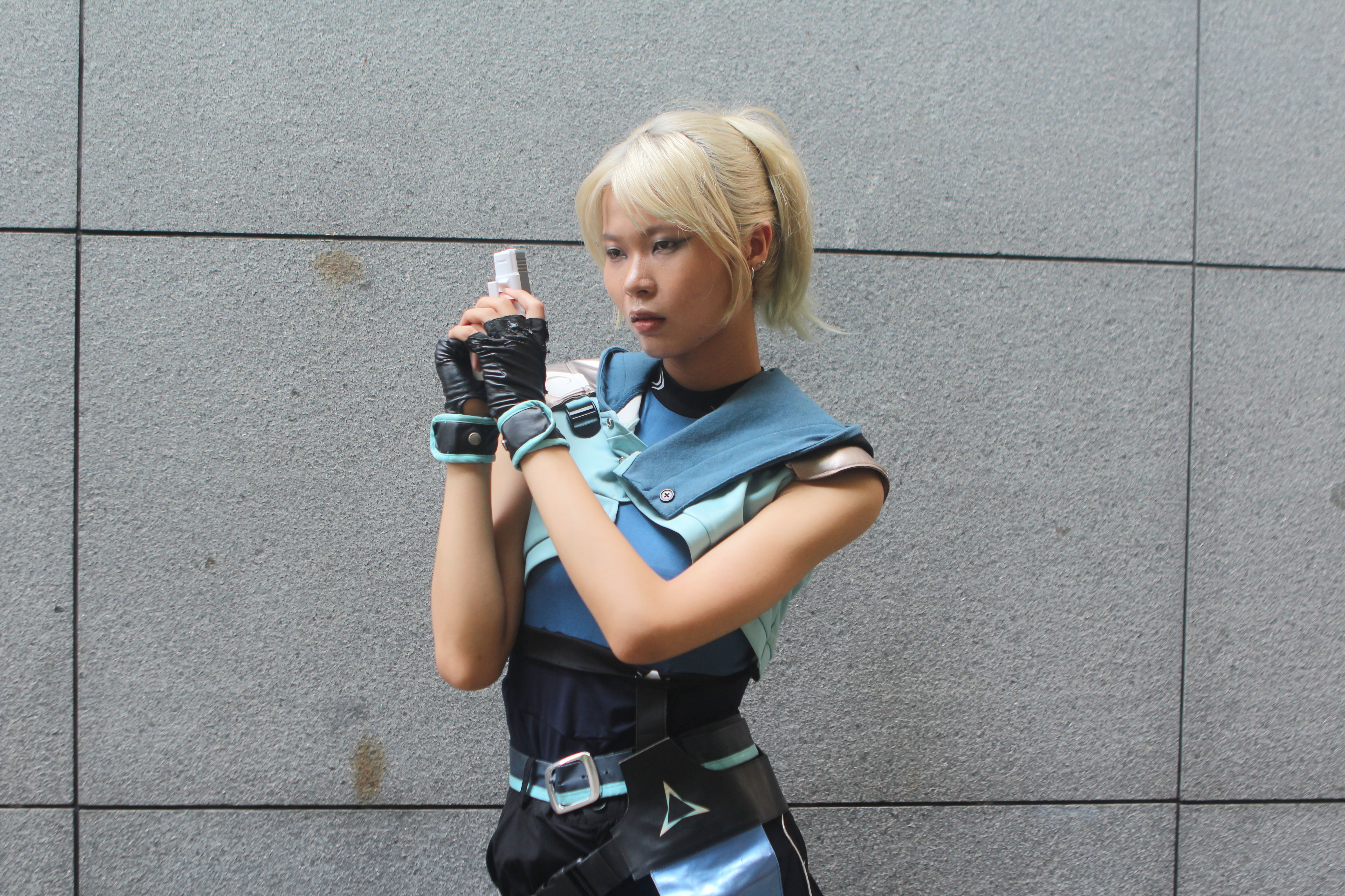 Cosplayer in Futuristic Costume Posing Outdoors · Free Stock Photo
