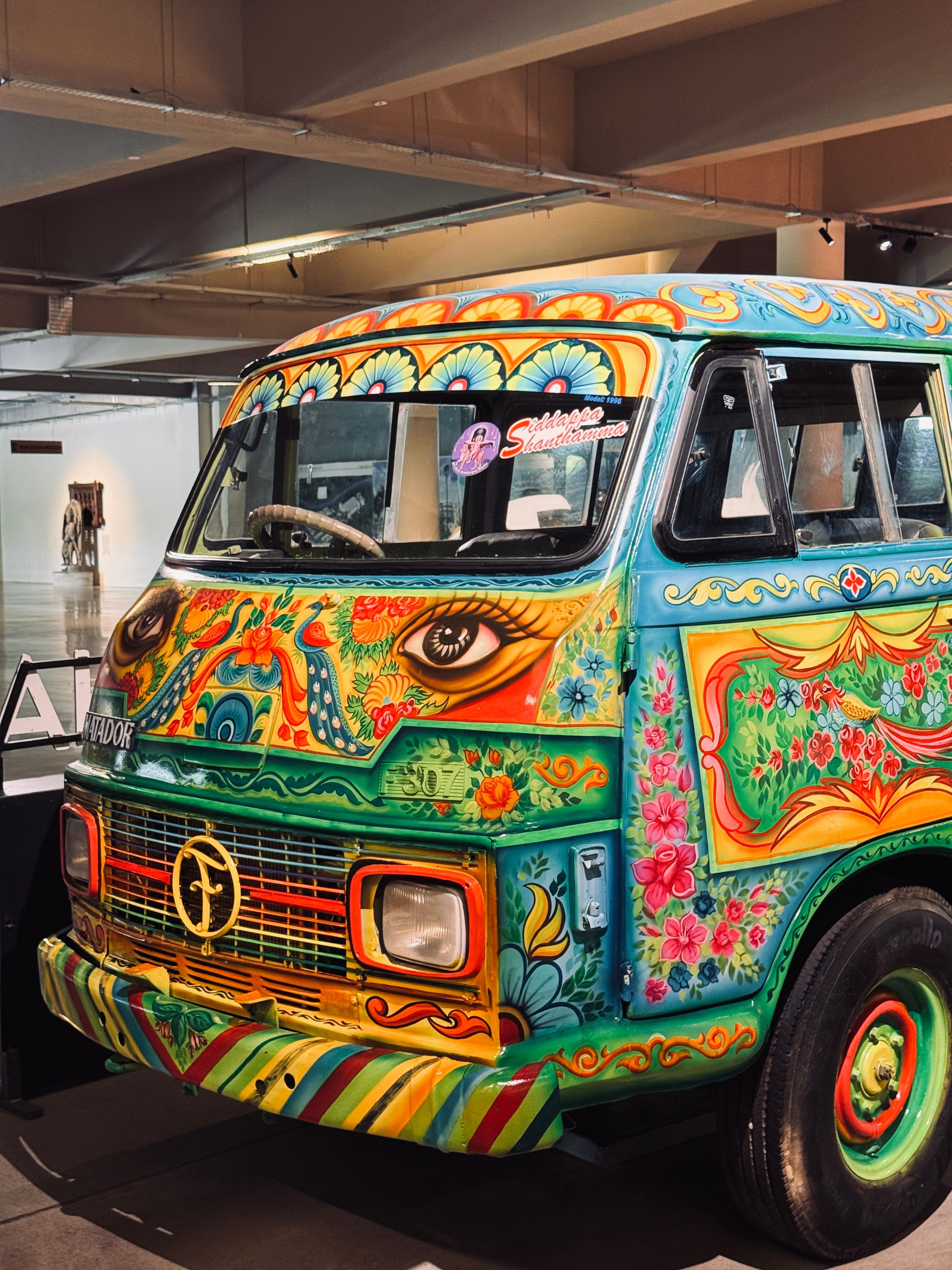 Colorful Art Van in Indoor Exhibition Setting · Free Stock Photo