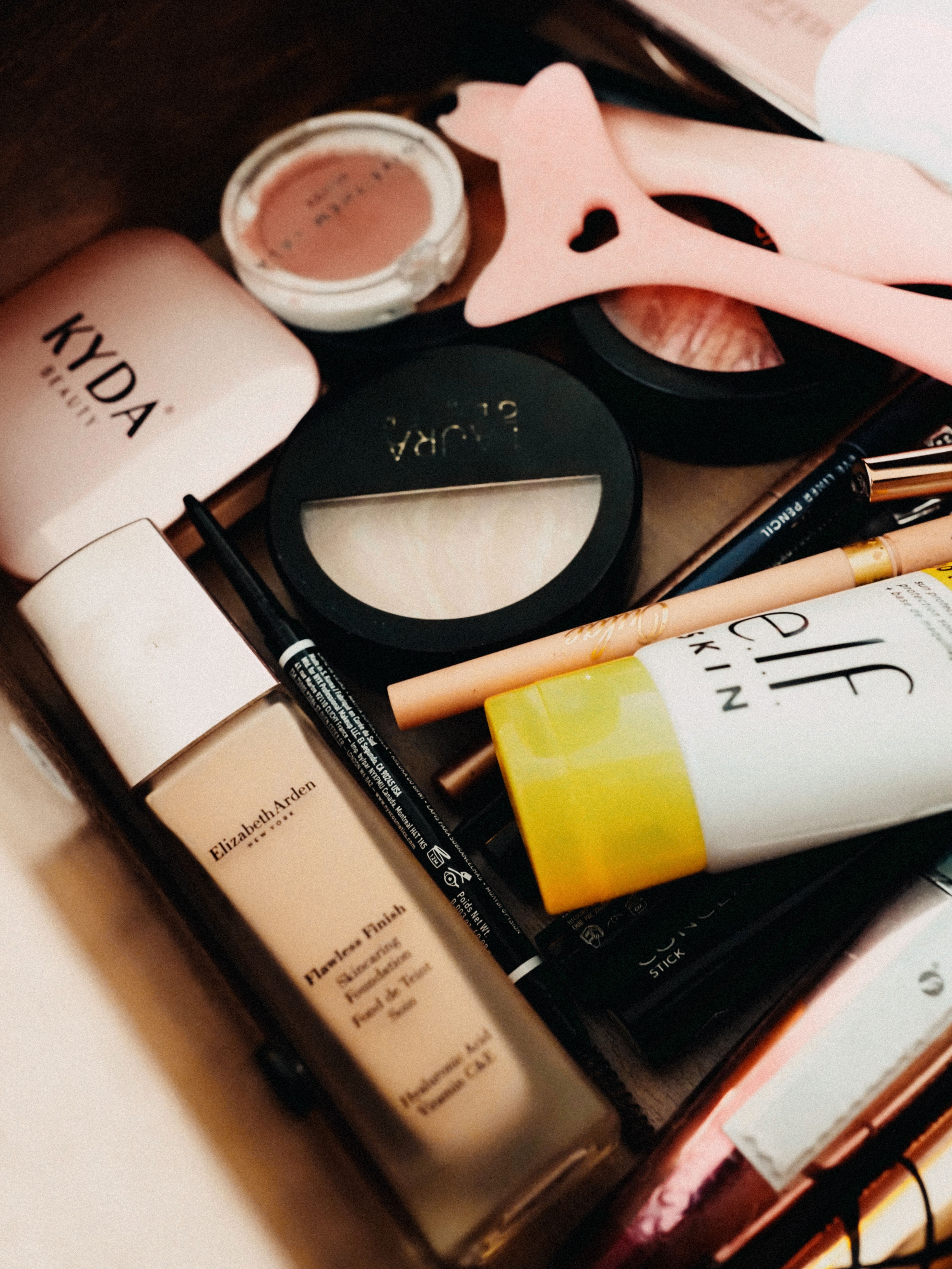 Flat Lay of Various Makeup Products in Drawer · Free Stock Photo