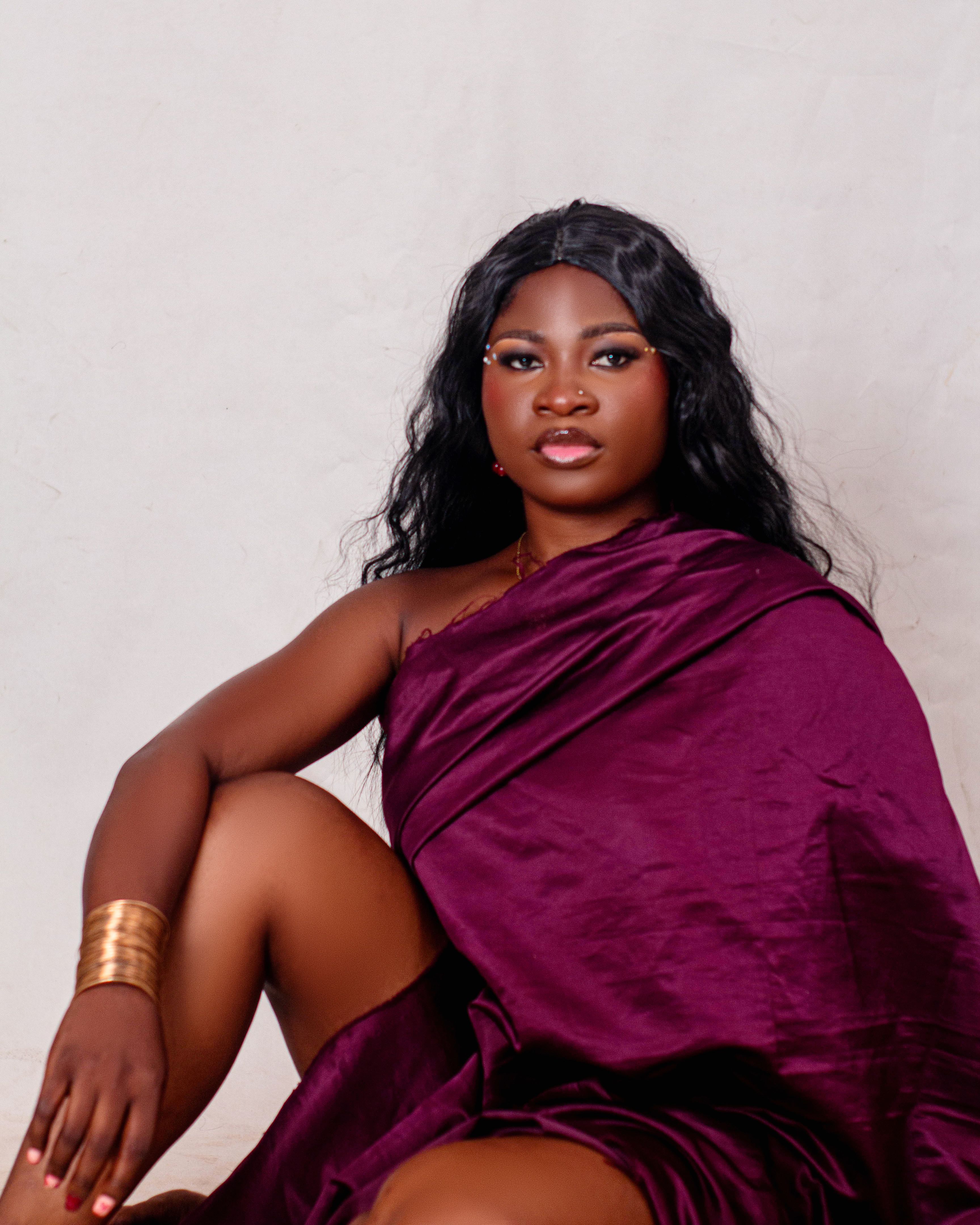 Elegant Portrait of Woman in Purple Drape · Free Stock Photo