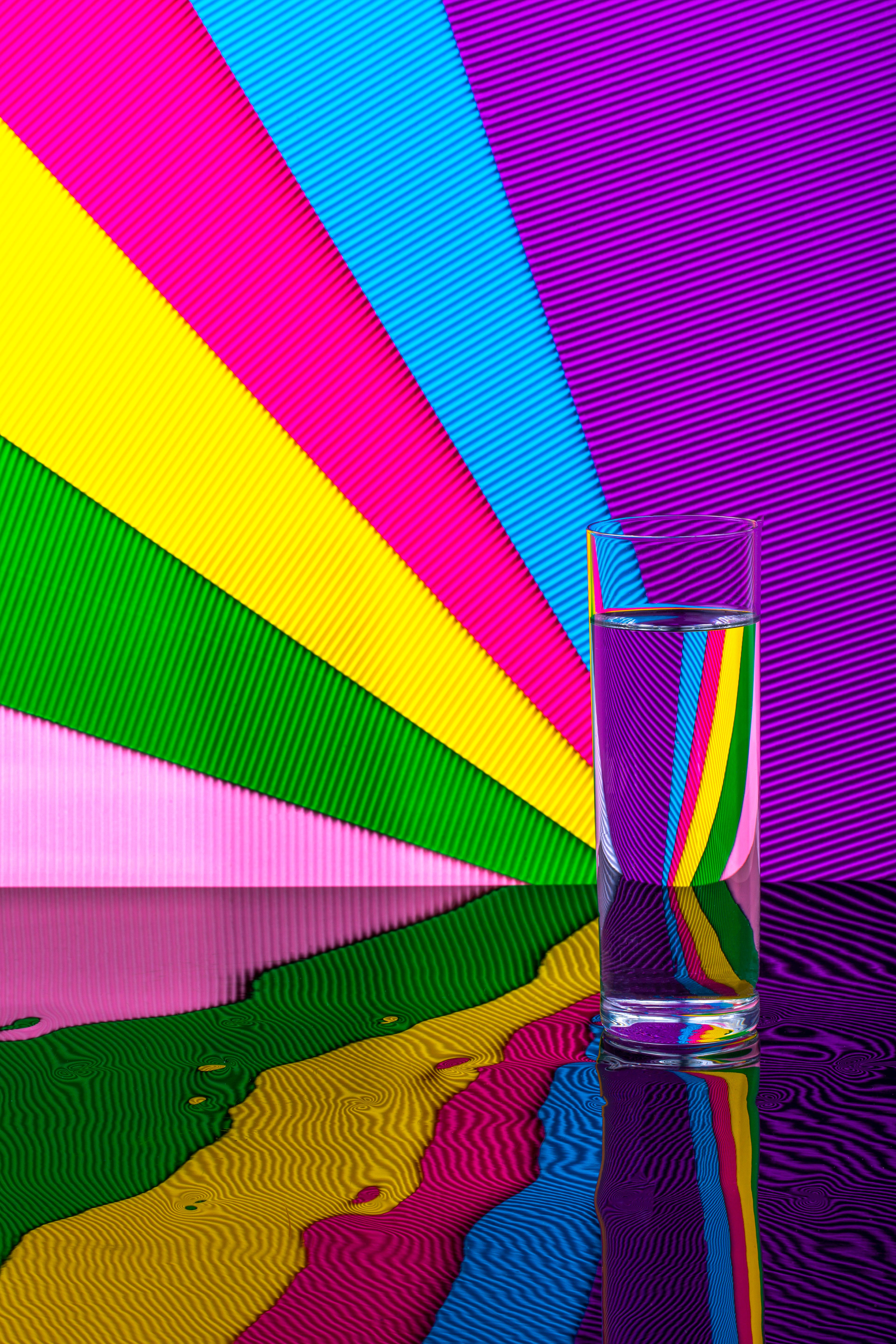 Vibrant Rainbow Reflection in Glass of Water · Free Stock Photo