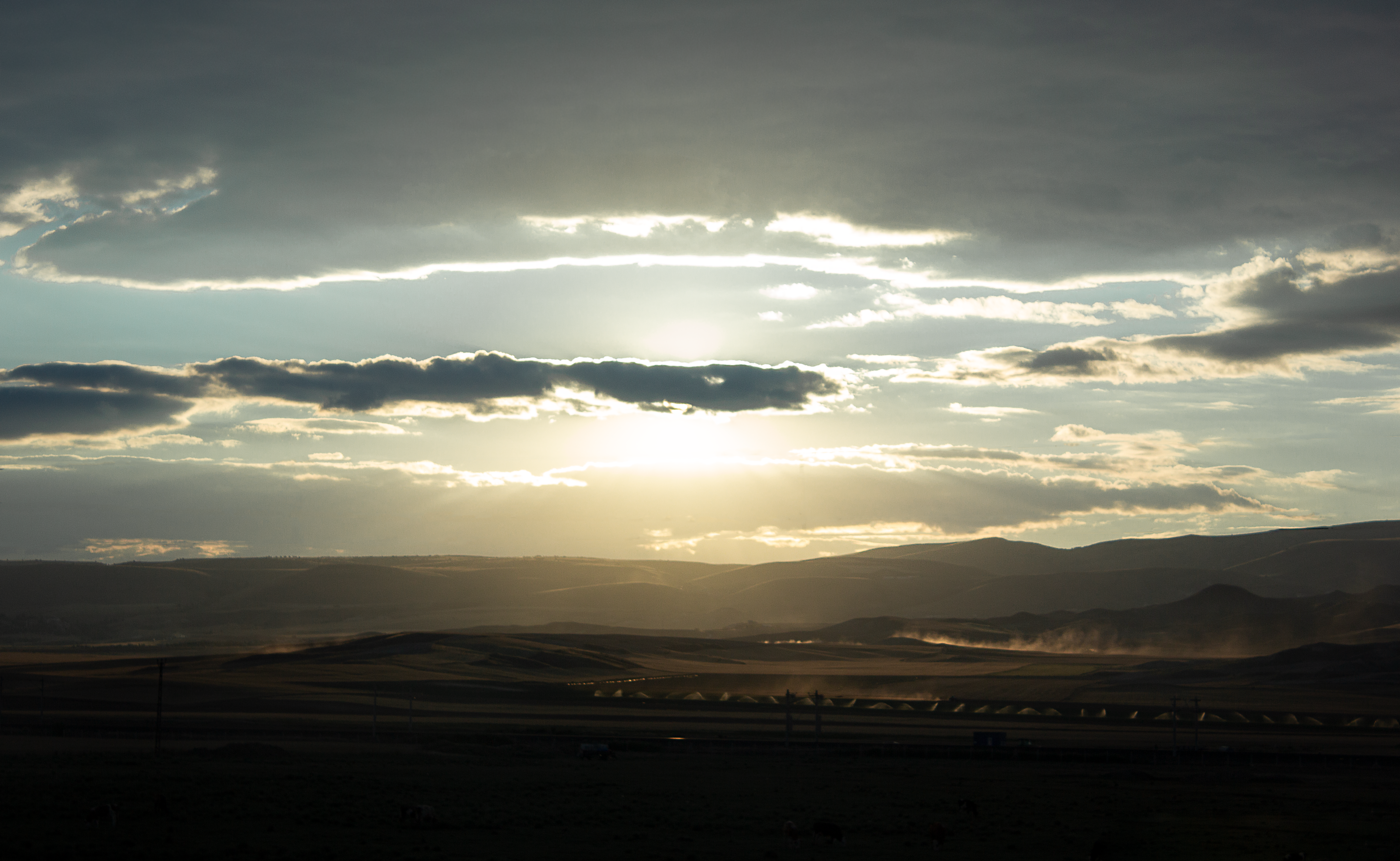 Dramatic Sunrise Over Rolling Hills Landscape · Free Stock Photo