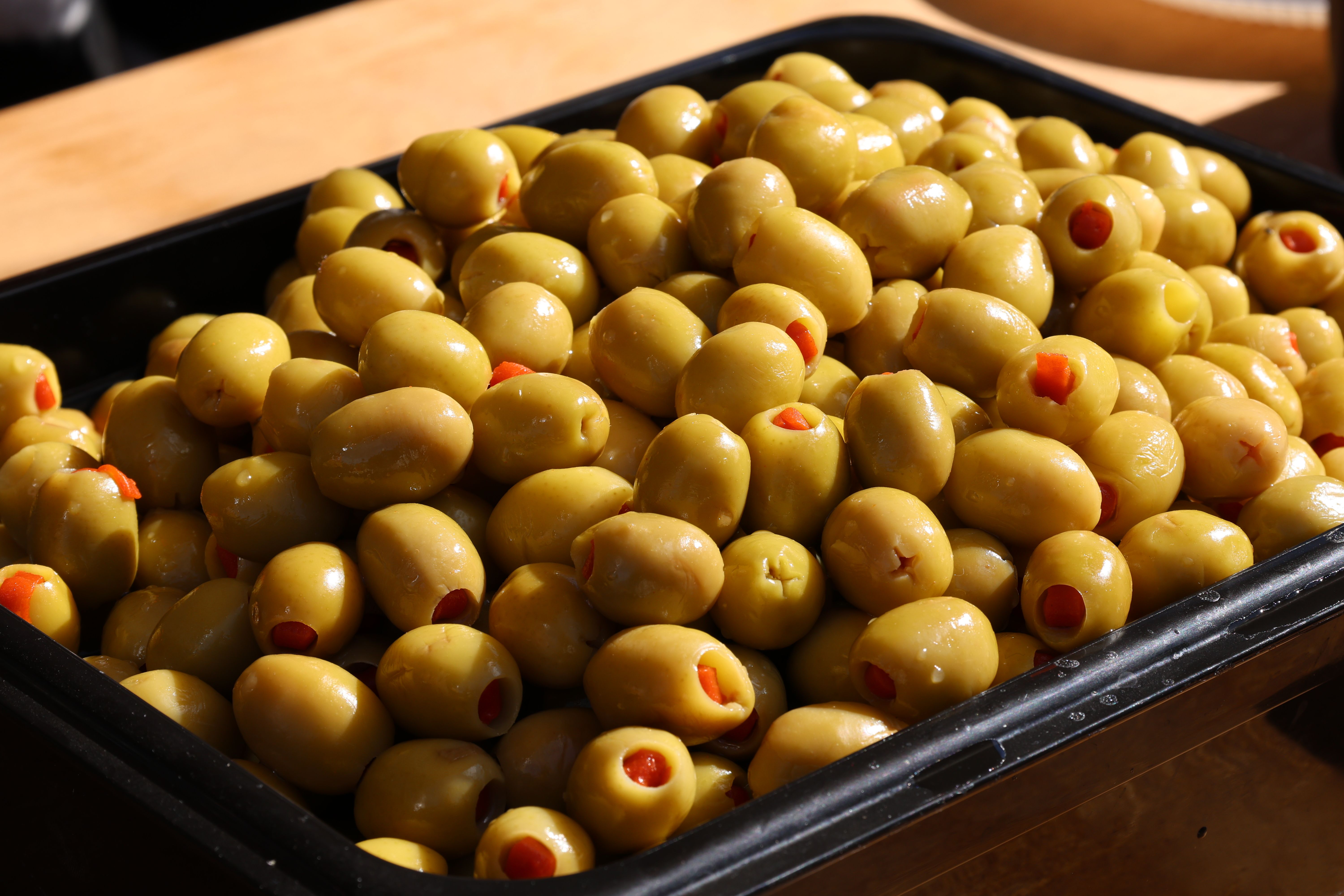 Fresh Green Olives in a Black Tray · Free Stock Photo