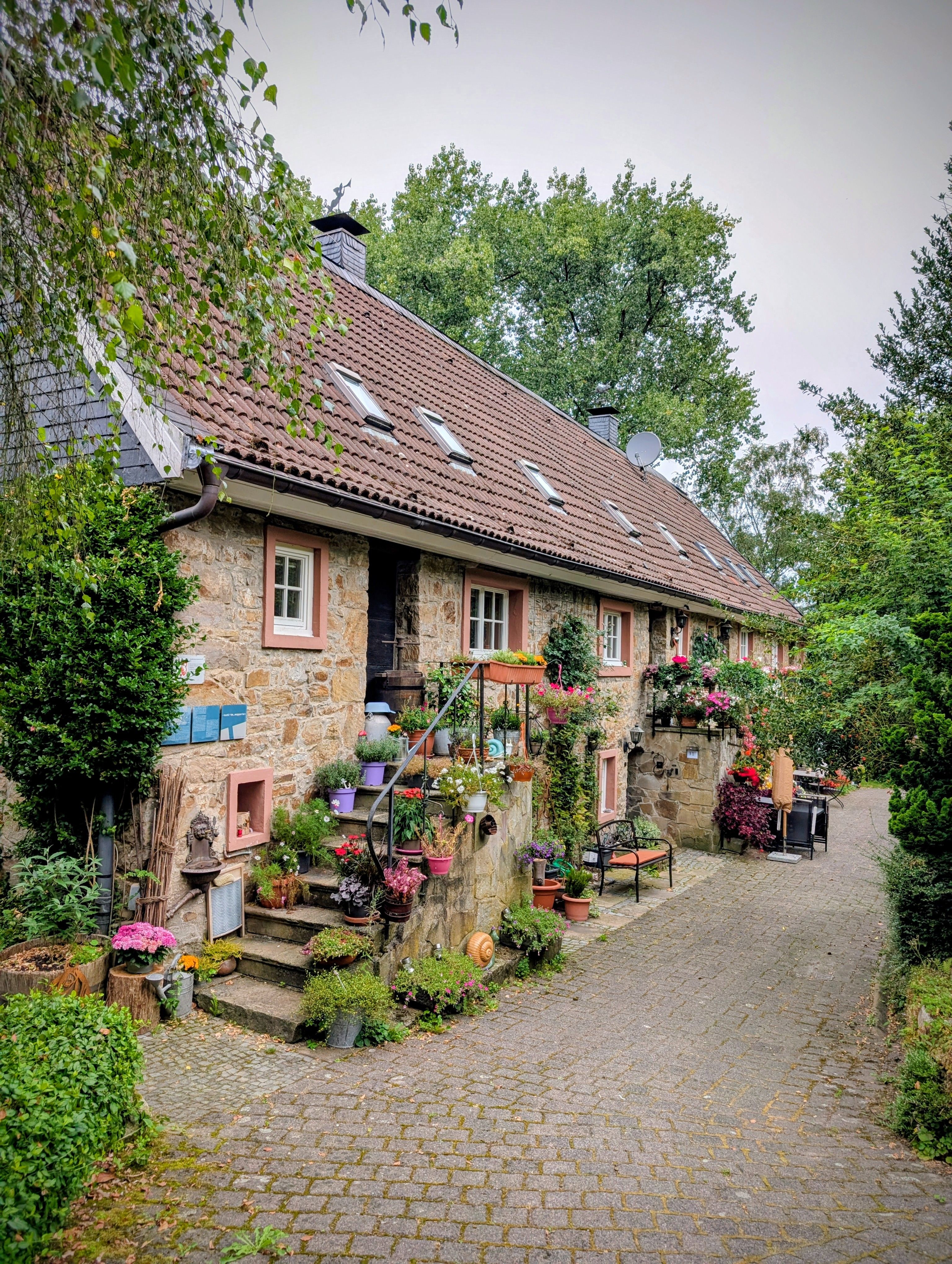Charming Stone Cottage in Lush Garden Setting · Free Stock Photo