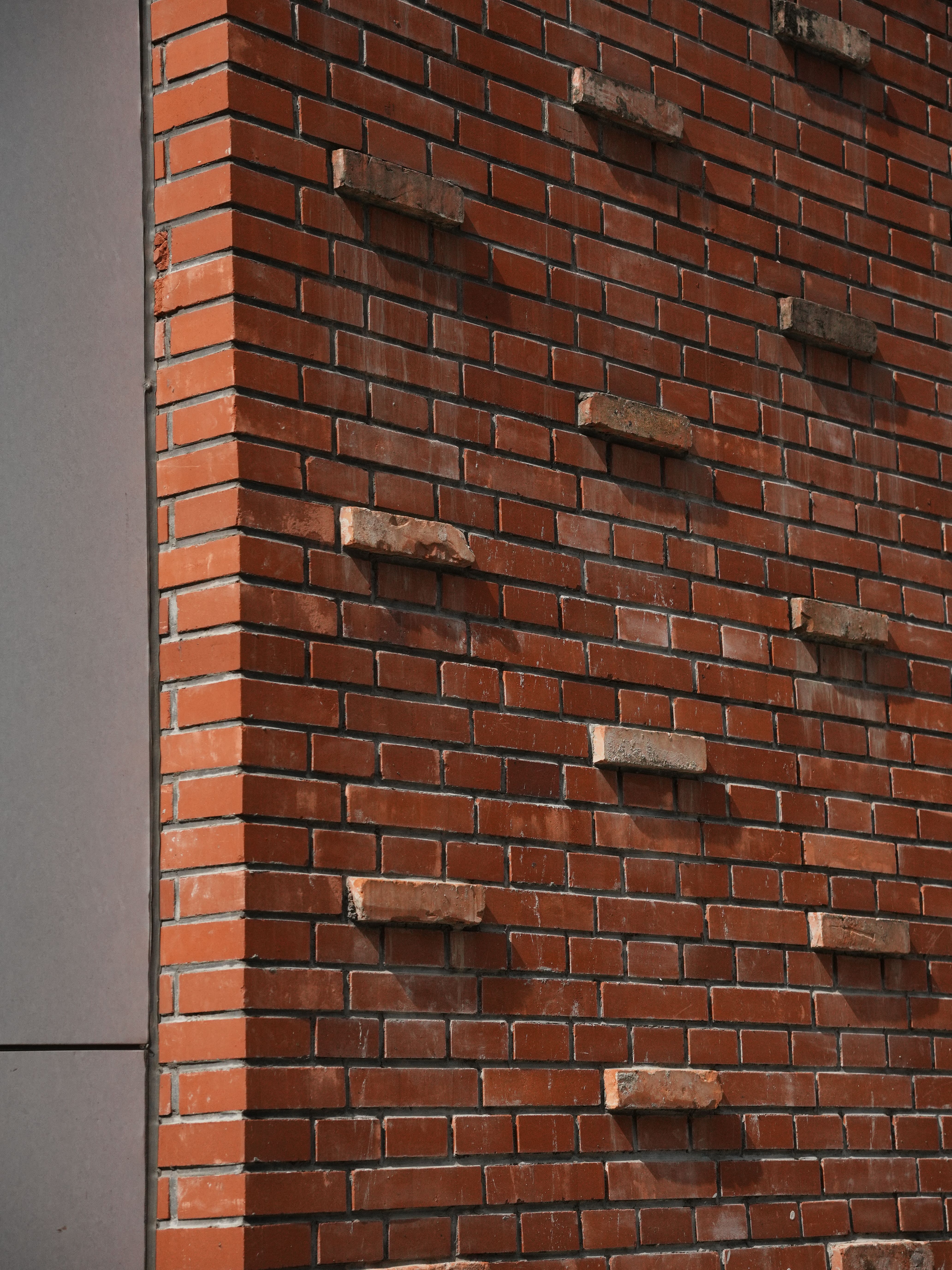 Brick Wall with Unique Staggered Pattern · Free Stock Photo