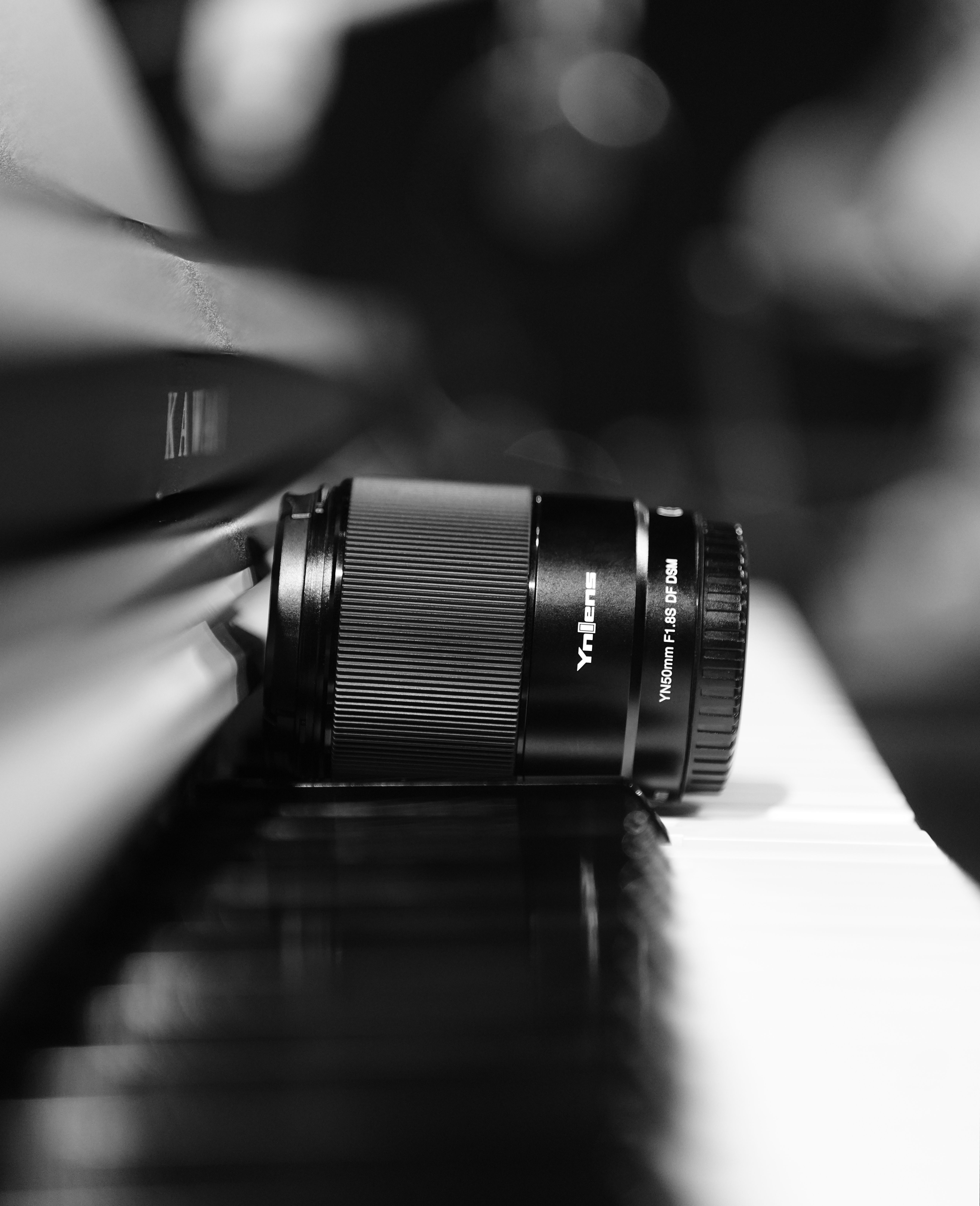 Close-up View of Camera Lens on Piano Keys · Free Stock Photo