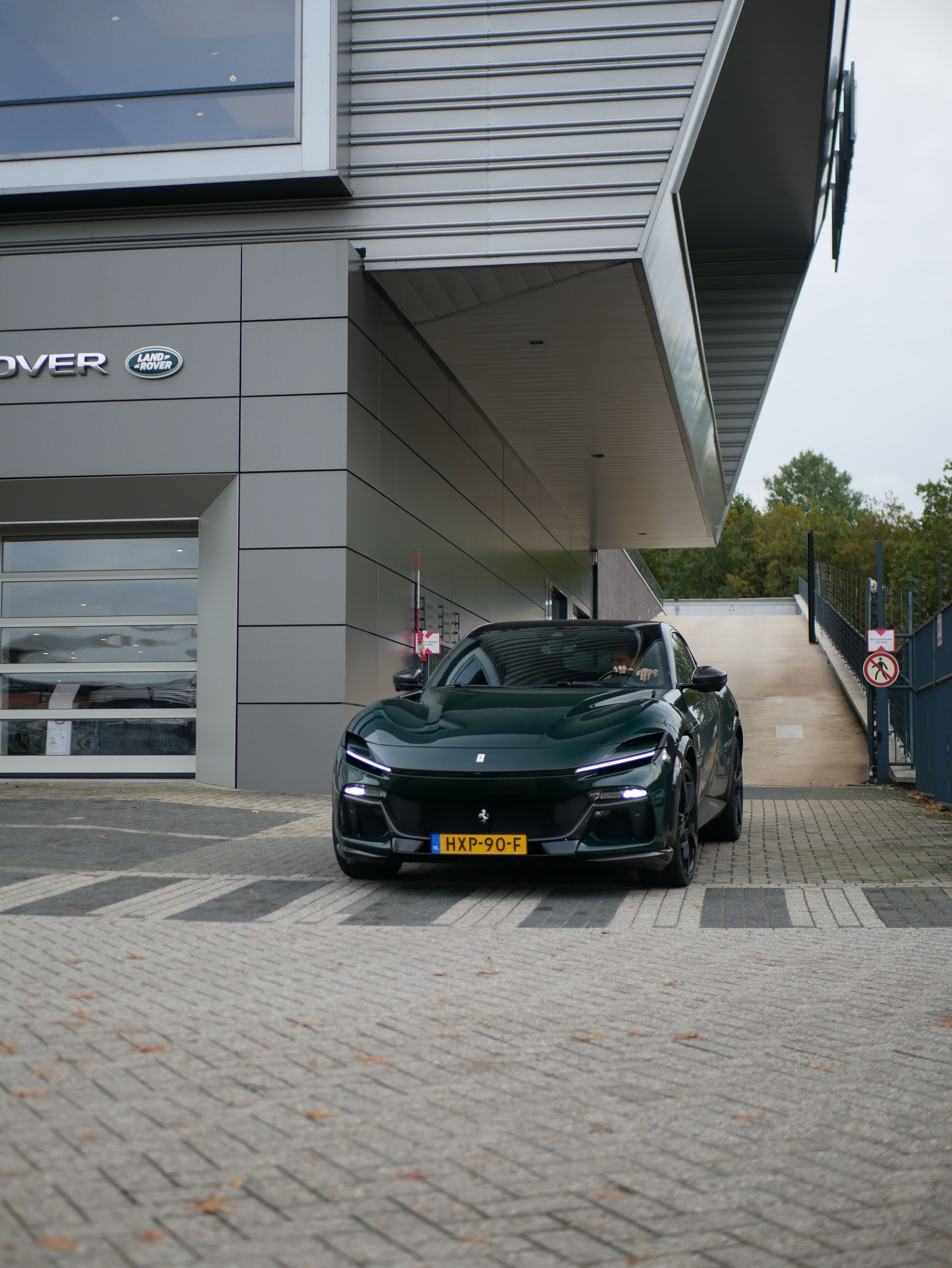 Luxury Car Outside Modern Dealership · Free Stock Photo