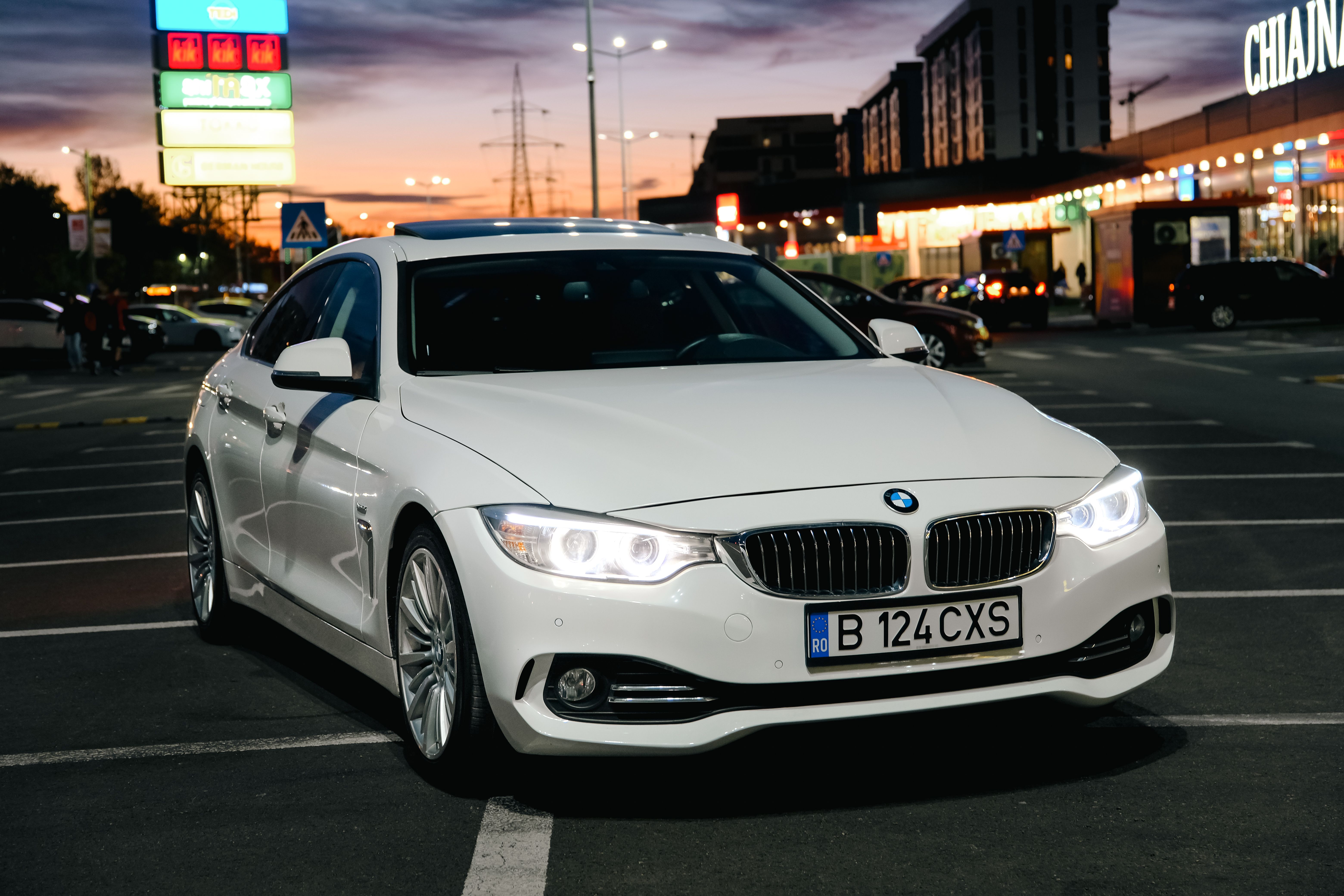 Modern white car in urban night setting · Free Stock Photo