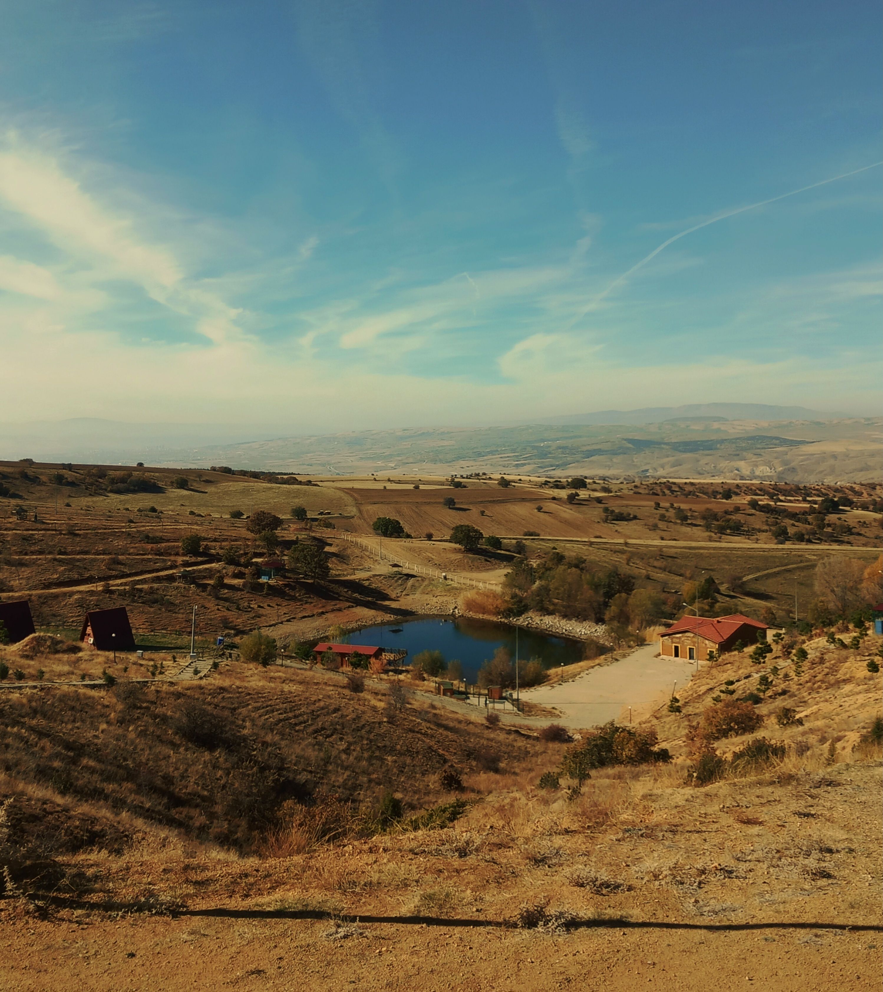 Vast Countryside Landscape with Small Pond · Free Stock Photo