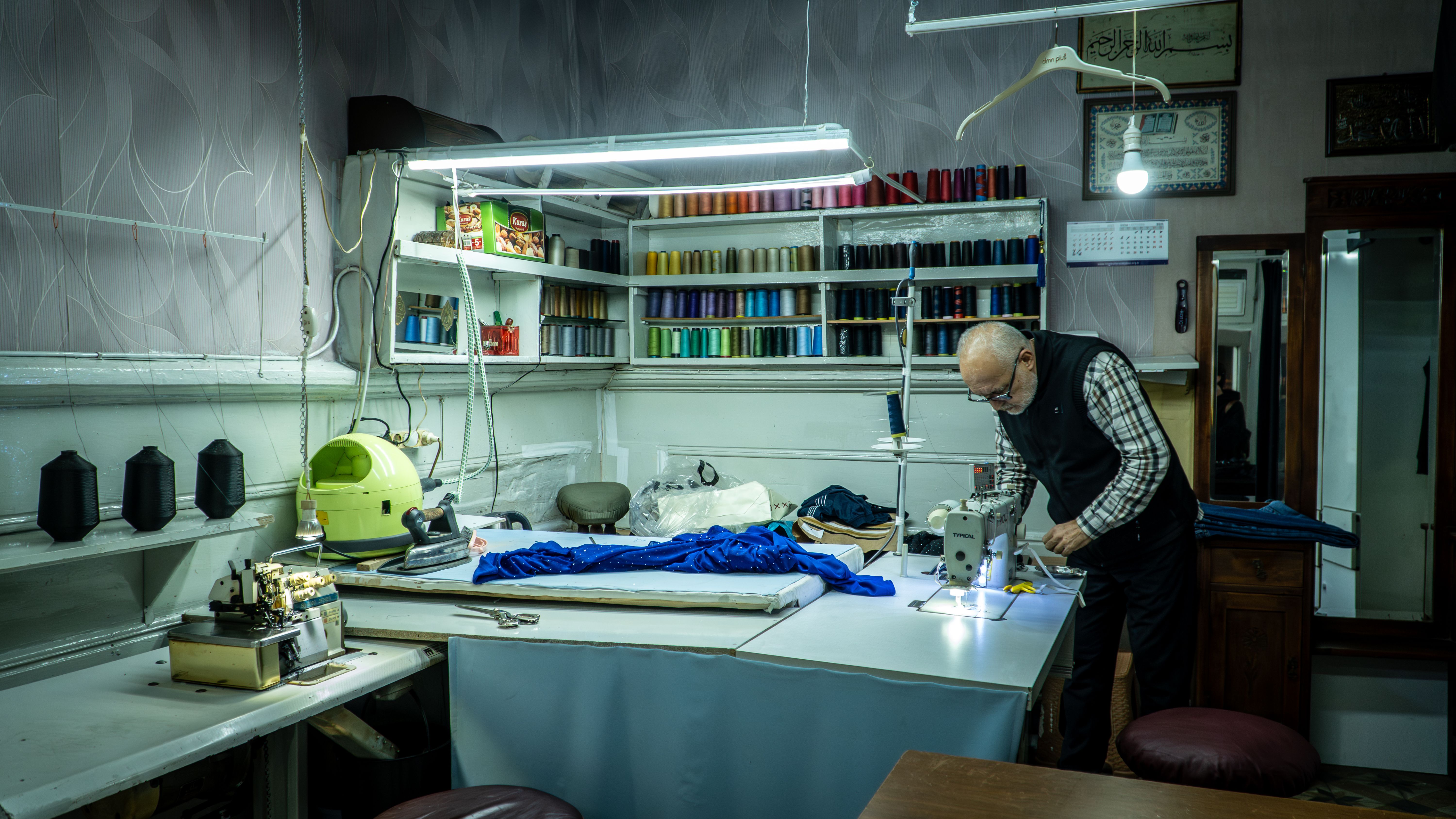 Tailor Working in a Traditional Sewing Workshop · Free Stock Photo