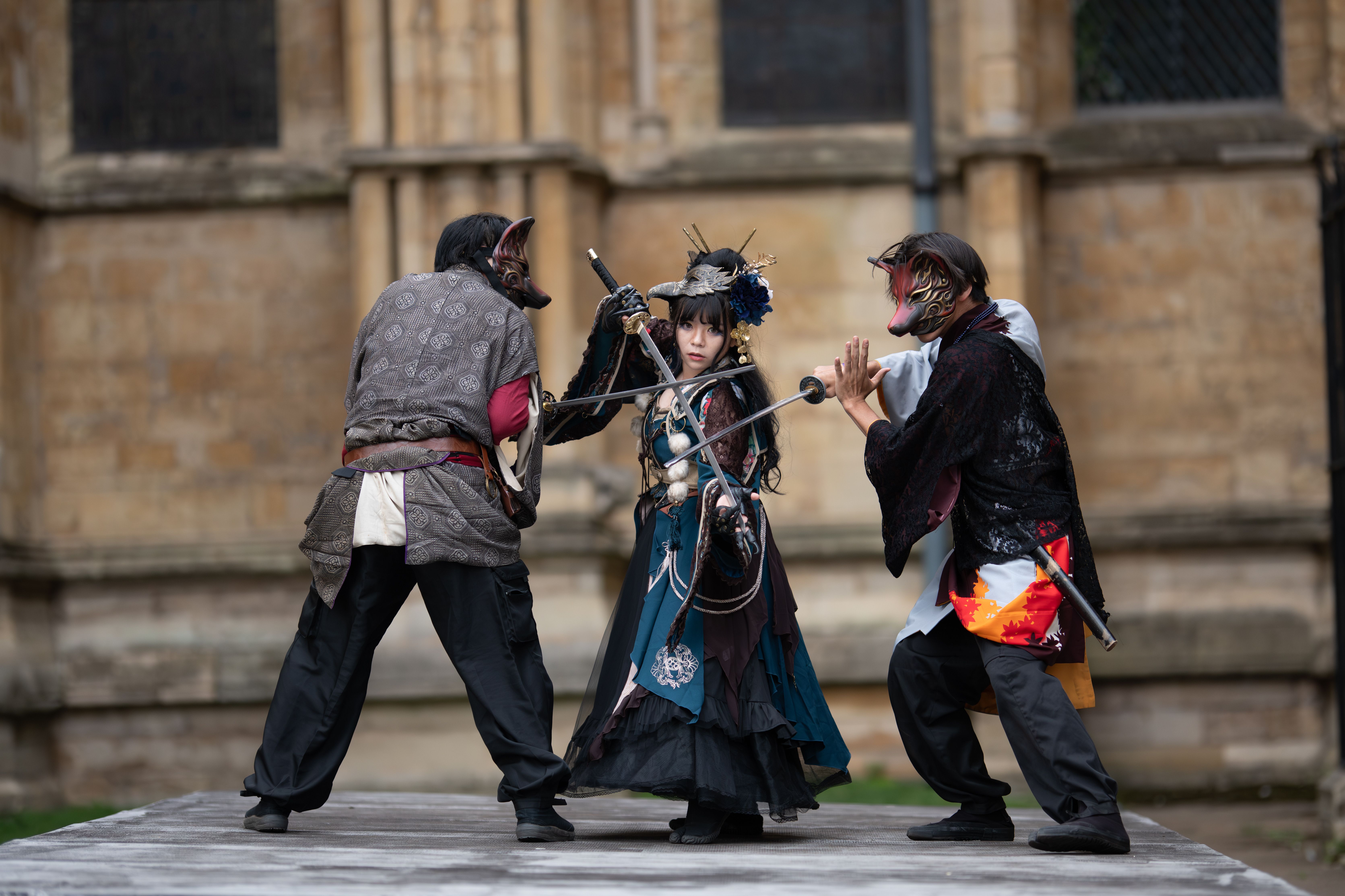 Cosplay Battle Performance in Medieval Setting · Free Stock Photo