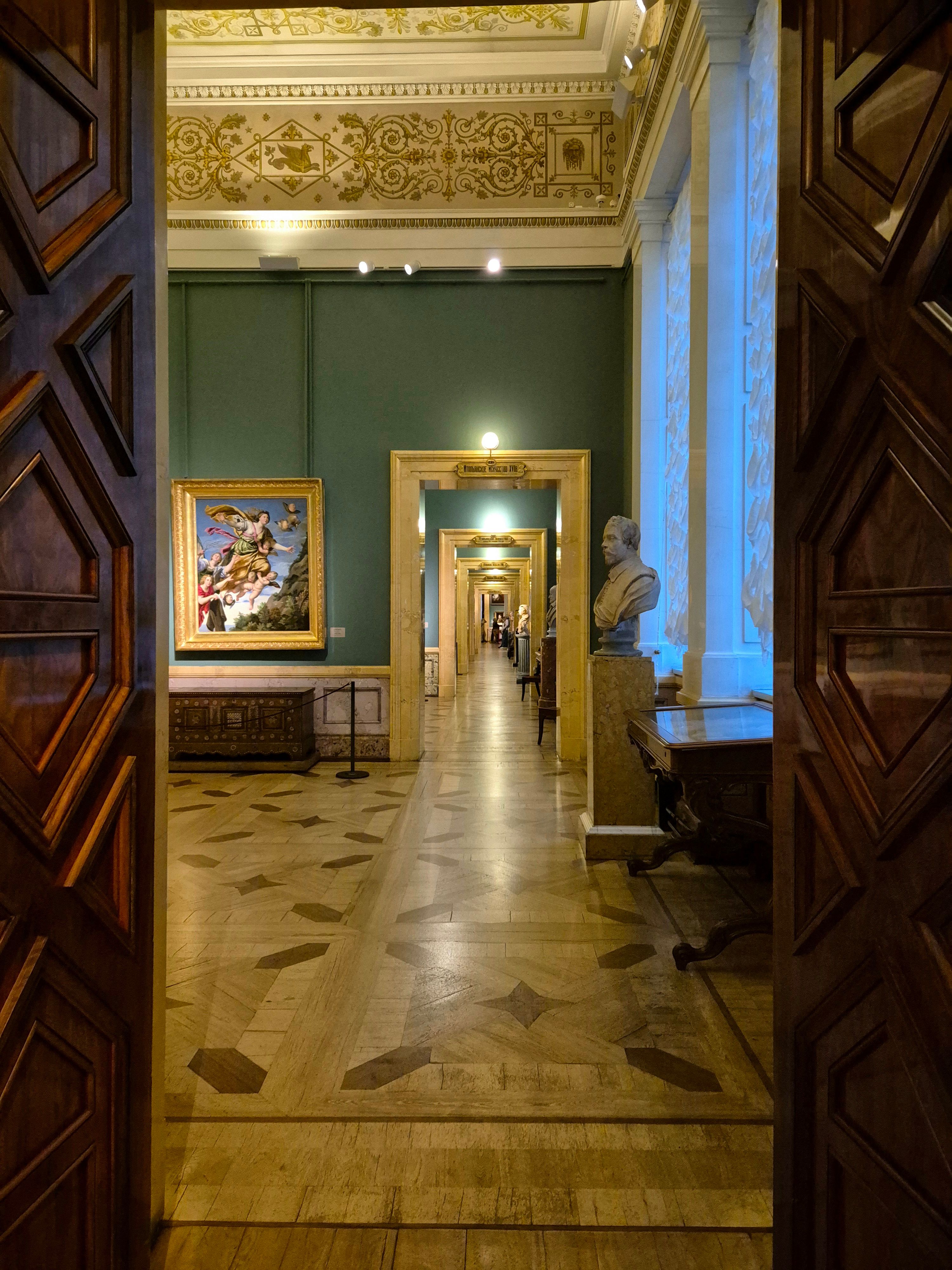 Elegant Museum Corridor with Classical Art · Free Stock Photo