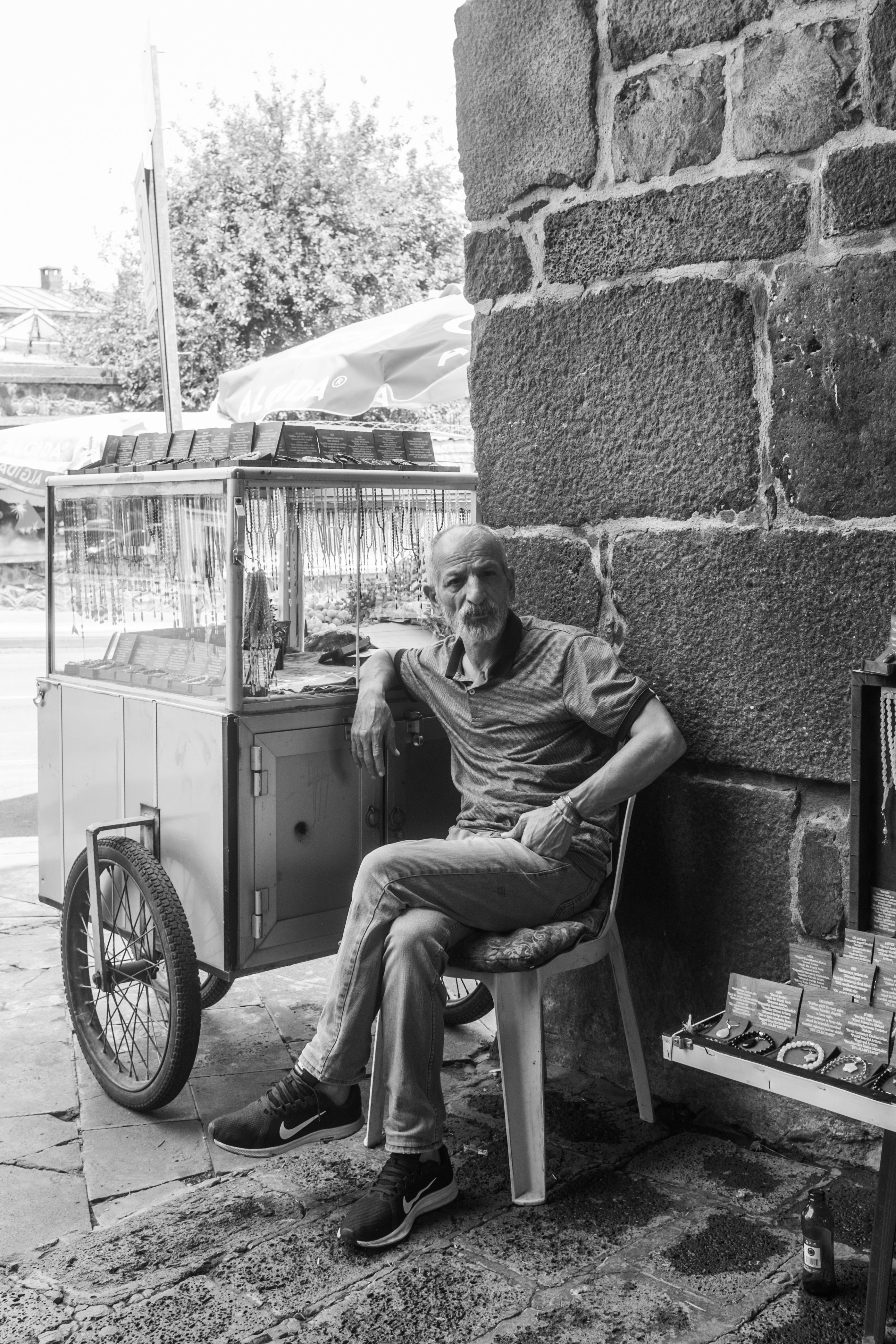 Black and White Street Portrait of Vendor · Free Stock Photo
