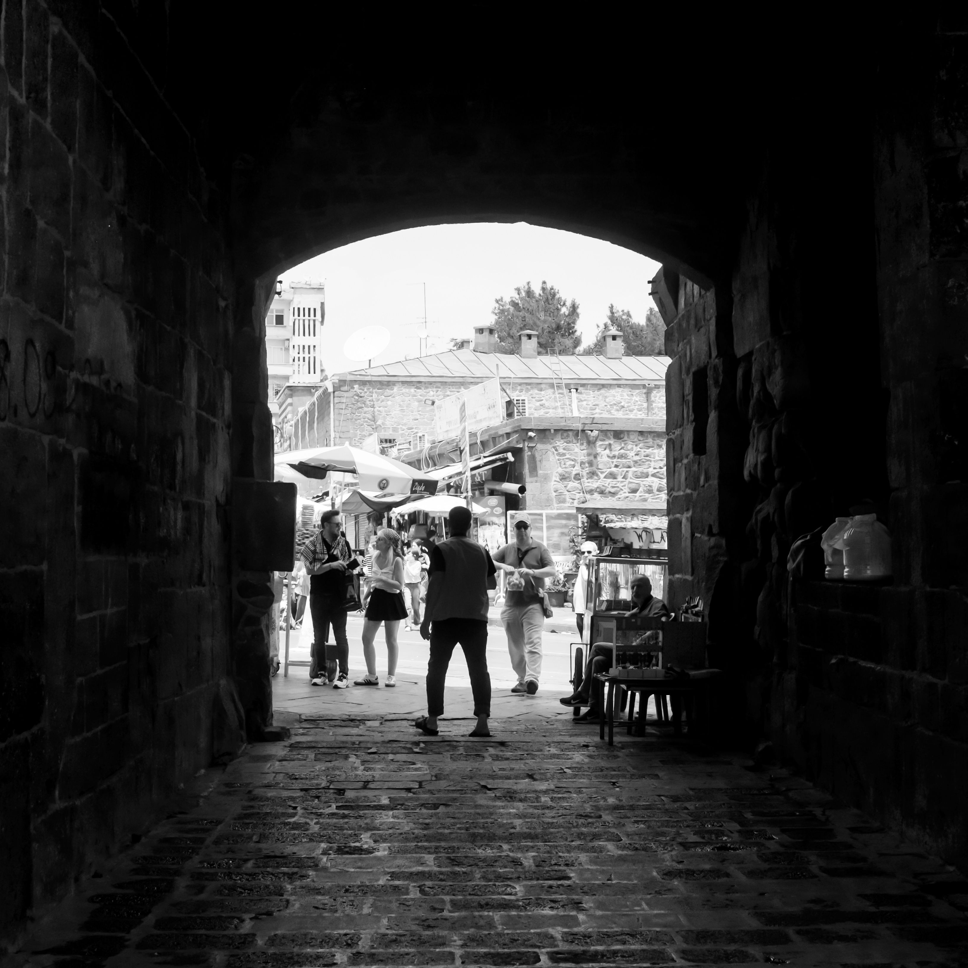 Street Scene Viewed Through Historical Archway · Free Stock Photo