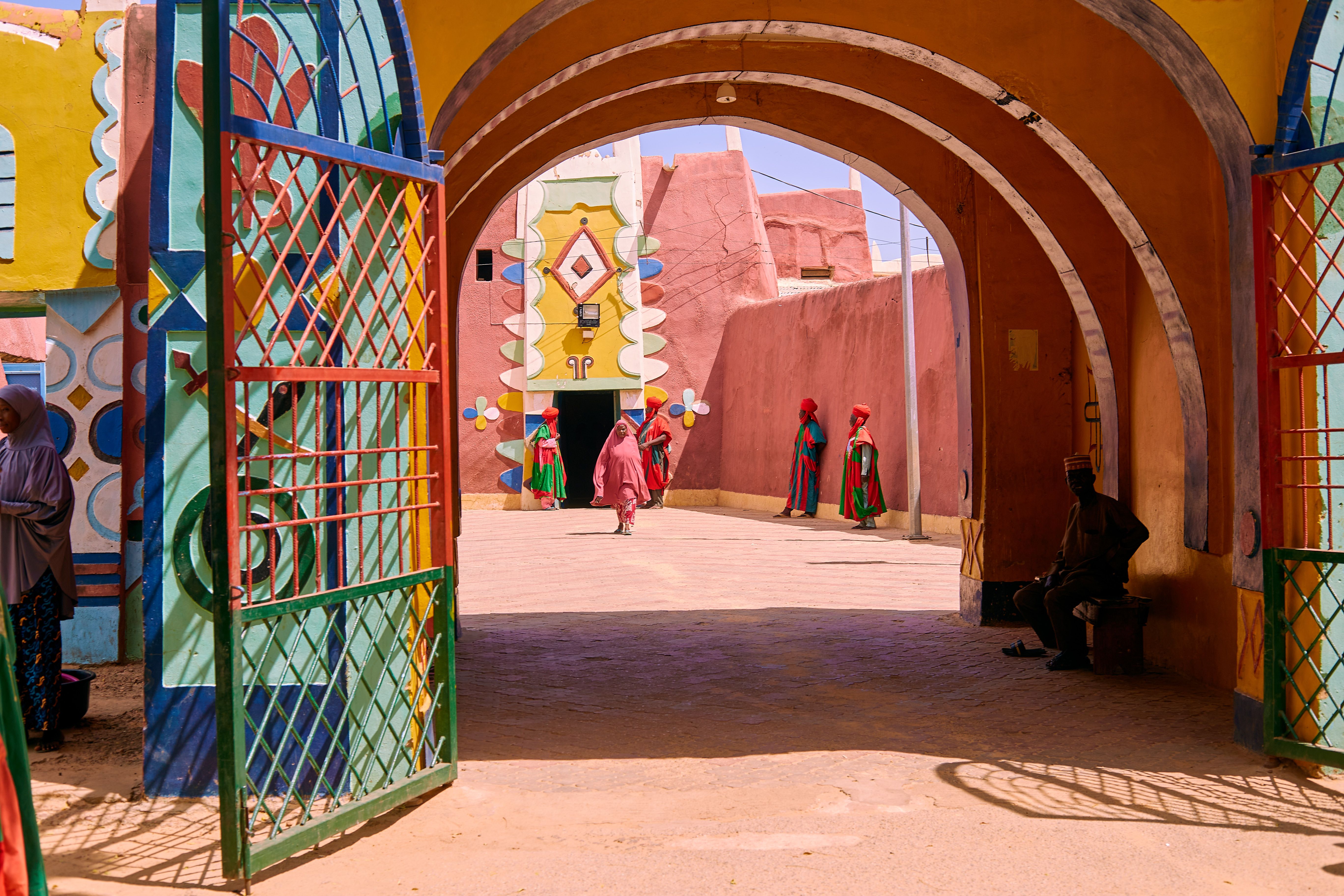 Colorful African Courtyard with Traditional Gates · Free Stock Photo