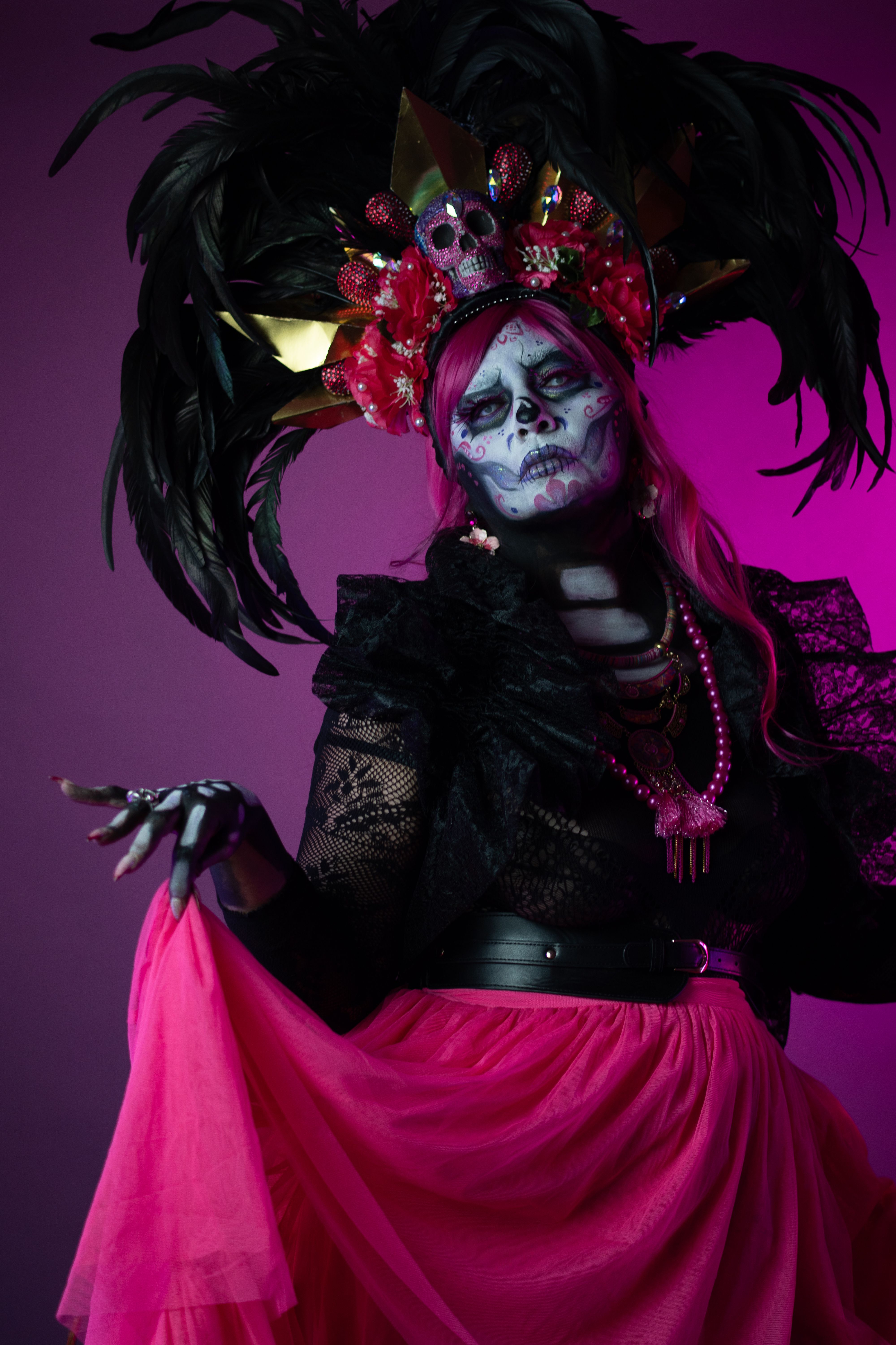 Colorful Catrina Costume in Vibrant Studio Portrait · Free Stock Photo