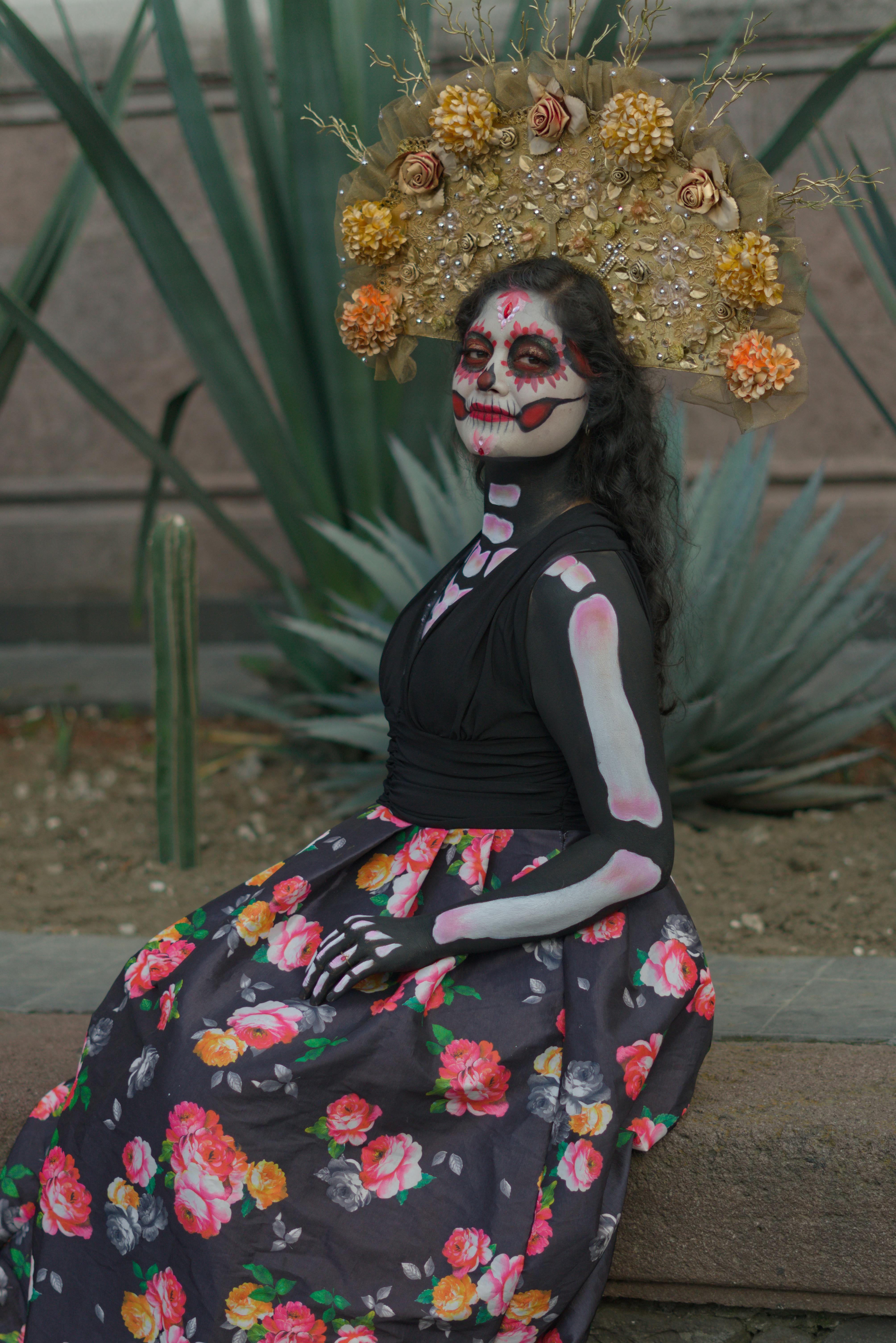 Woman in Traditional Dress with Cacti Background · Free Stock Photo