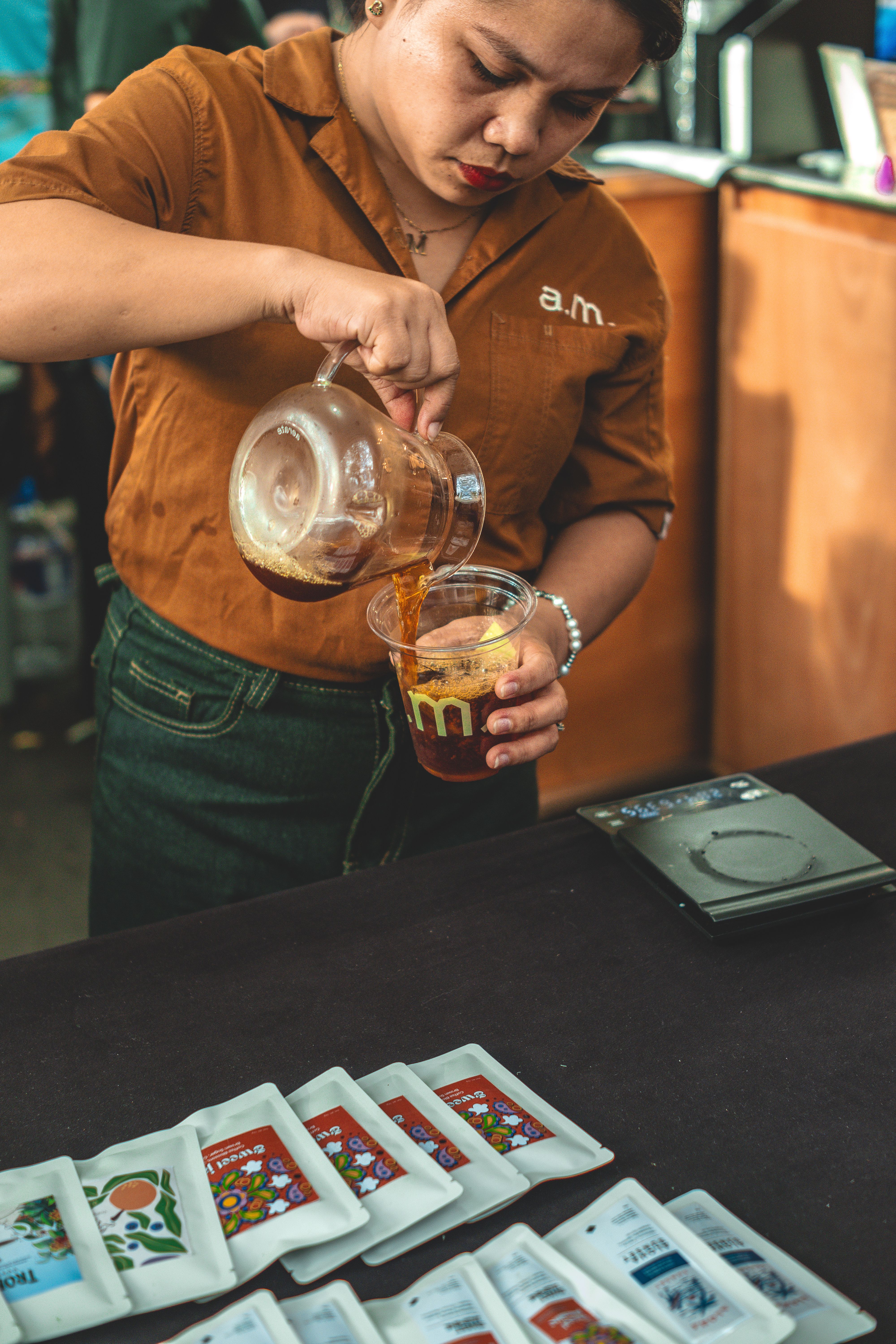Barista Pouring Coffee at Outdoor Event · Free Stock Photo